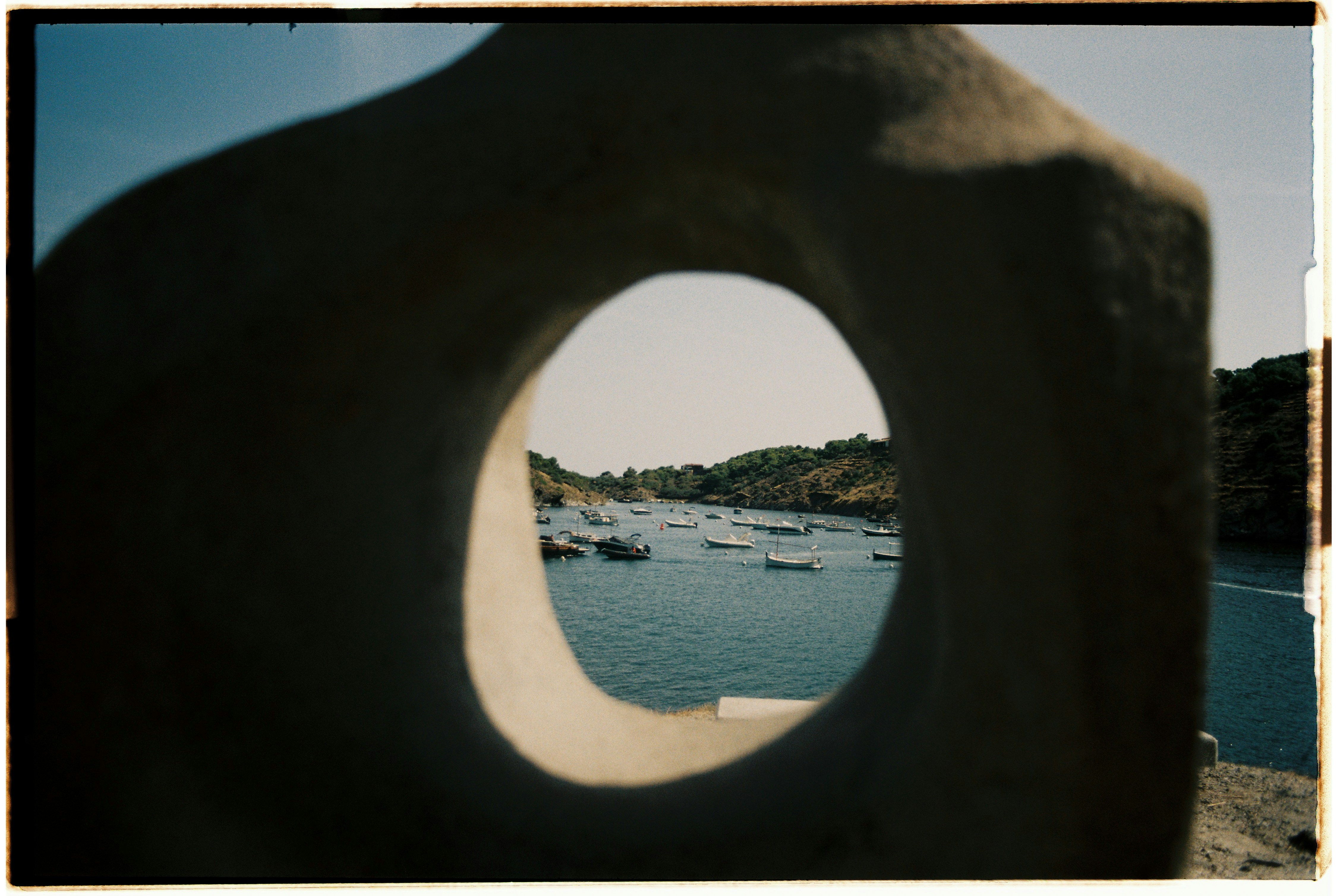 Circular Aperture to Harbor: Framed View Through a Stone Ring