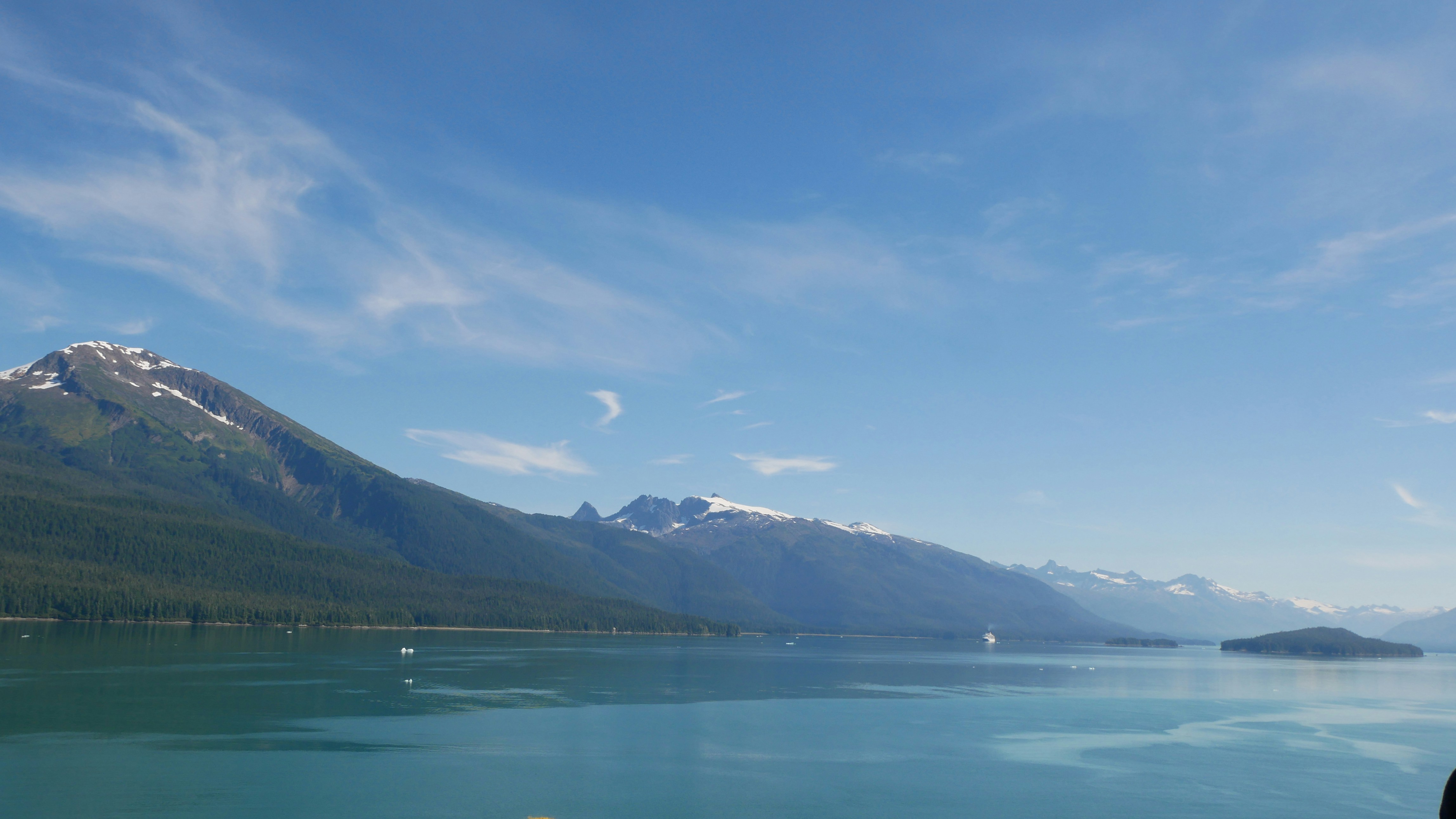 Snow-tipped Peaks Over a Glassy Glacier Lake