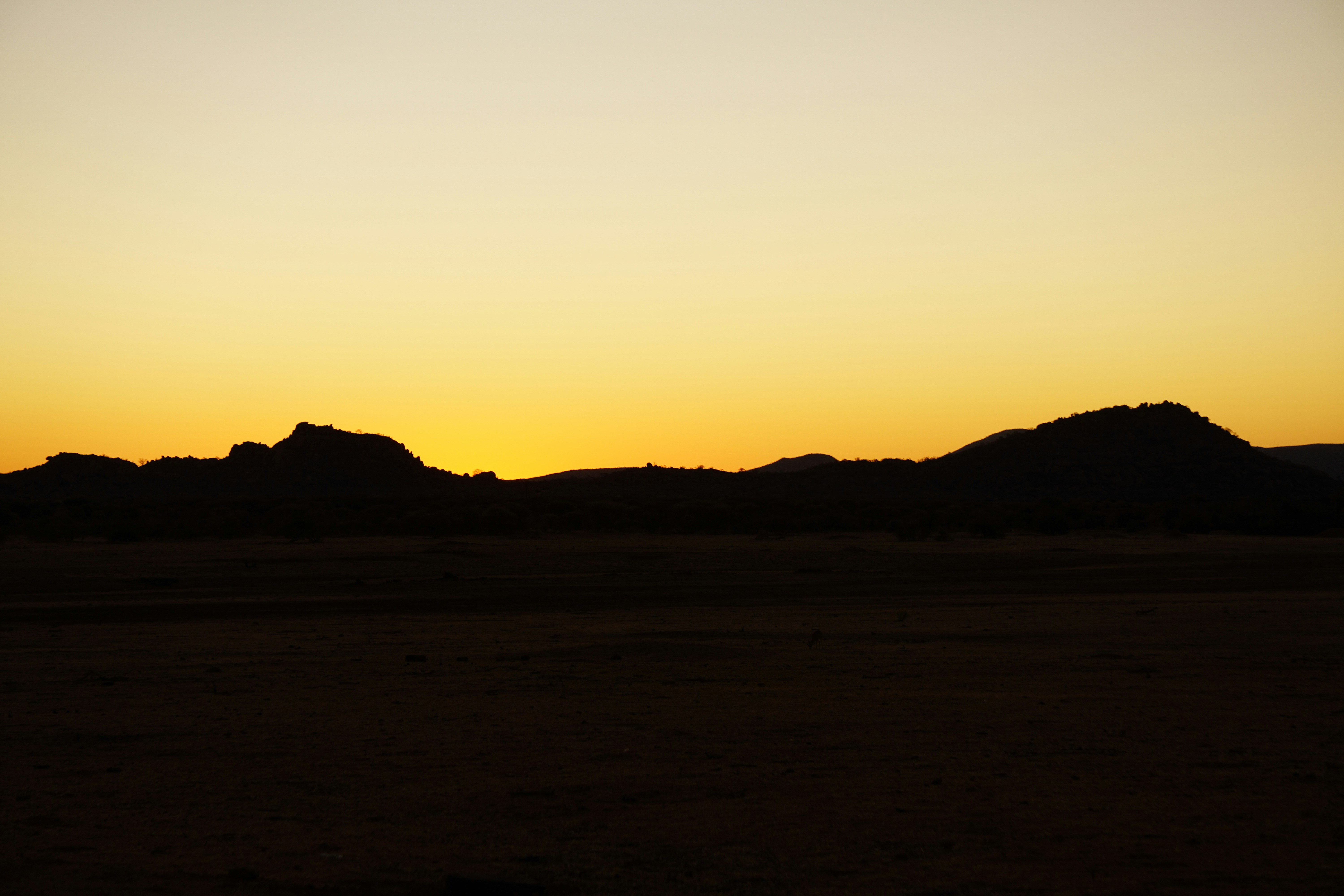 Silhouette Horizon at Dusk over Quiet Desert