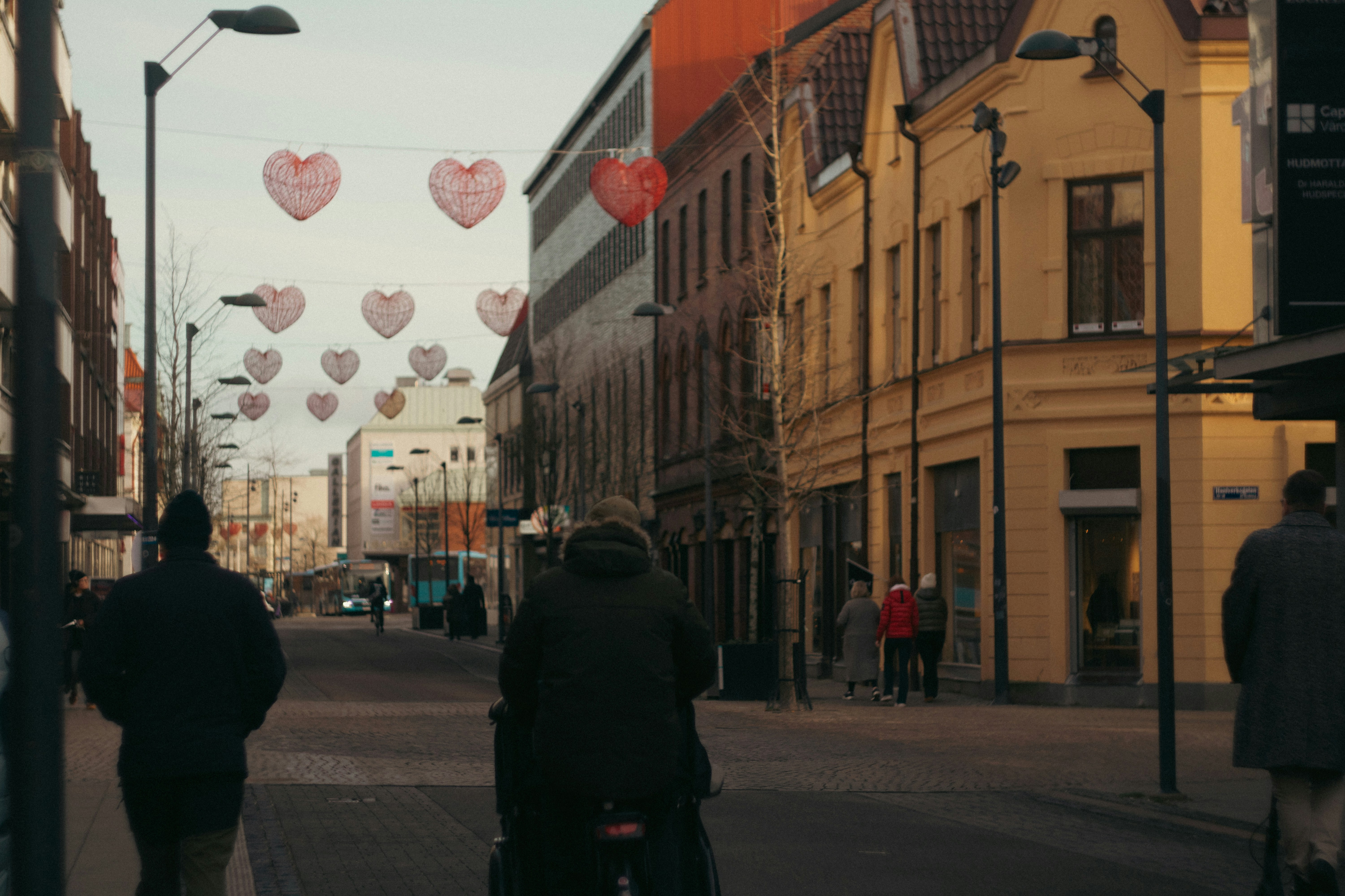 Love in the City: Heart Flags Above a Quiet Boulevard