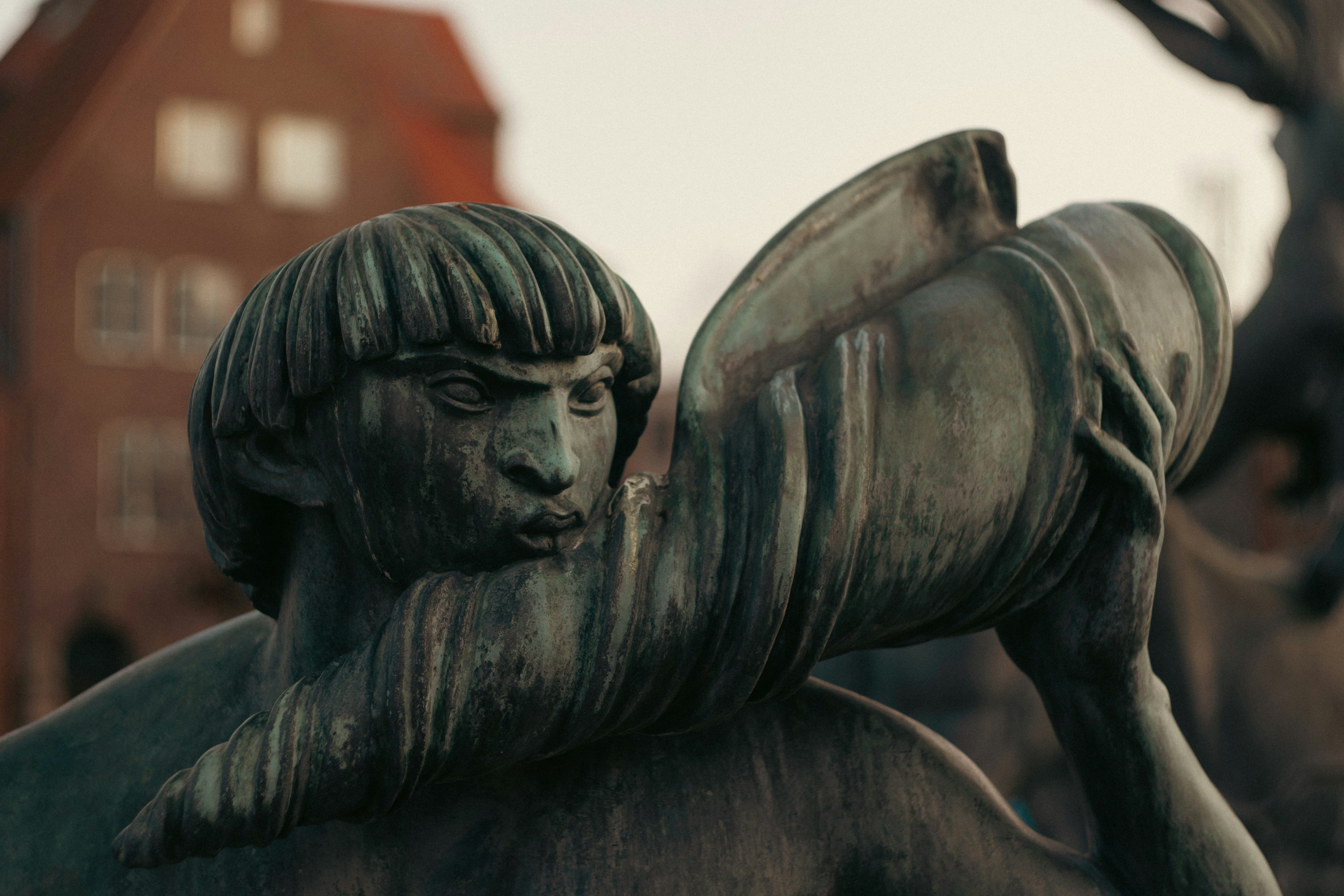 Gesture of Strength: A Bronze Figure Clasped in Time