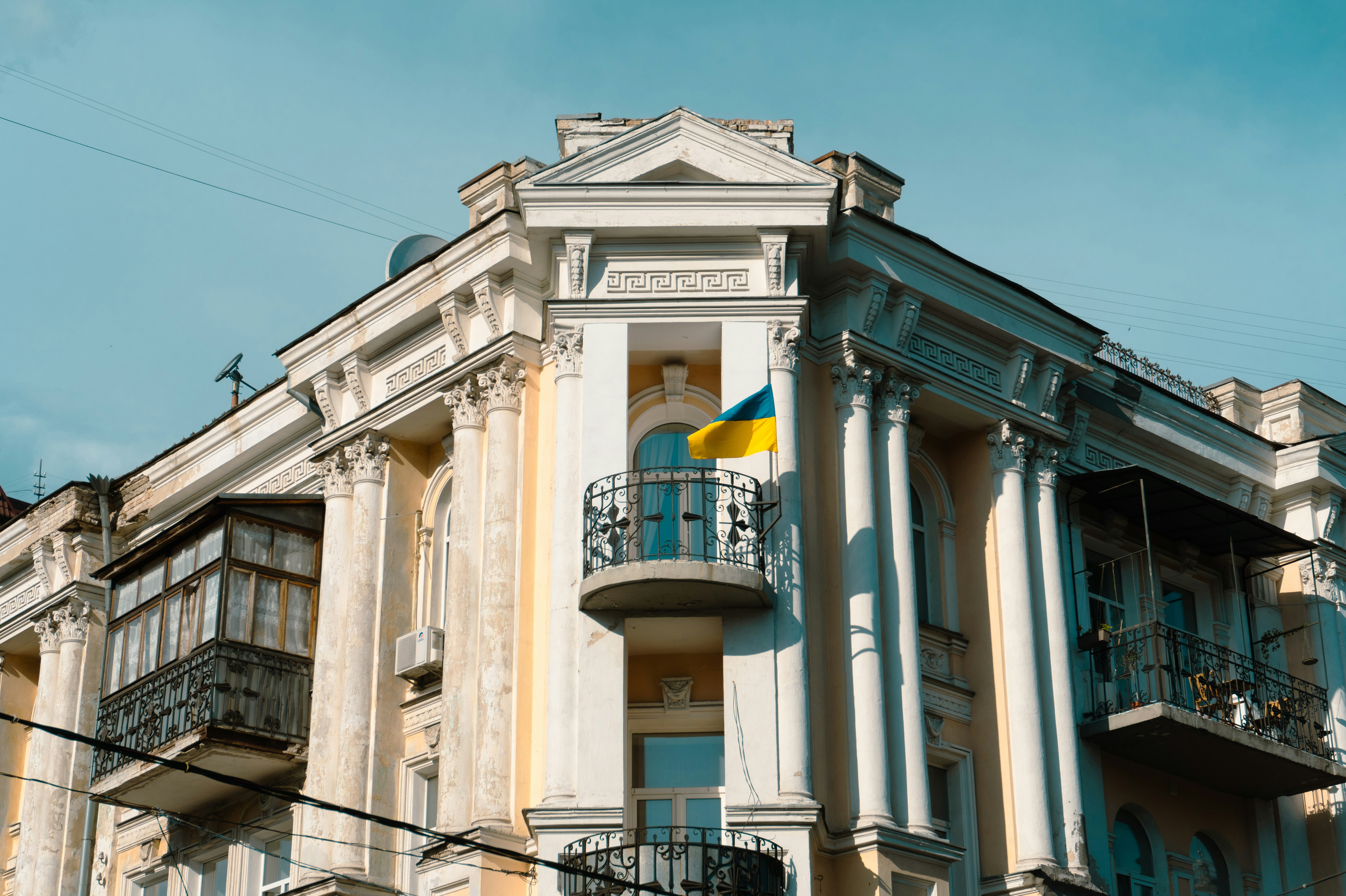 Flag against Neo-classical Facade: A Ukrainian Balcony Scene