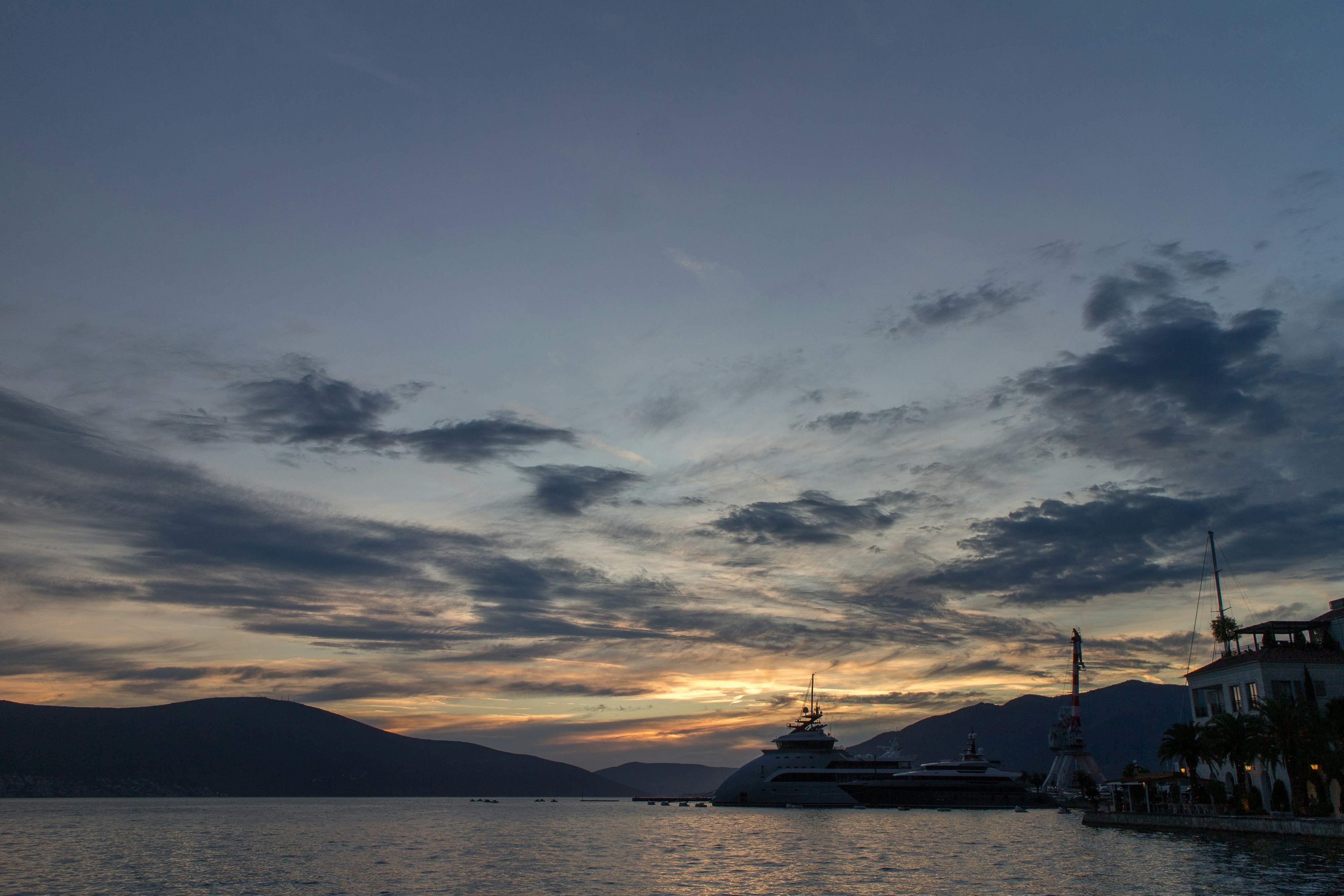 Dusk over the Marina: Boats Silhouetted Against a Quiet Fjord
