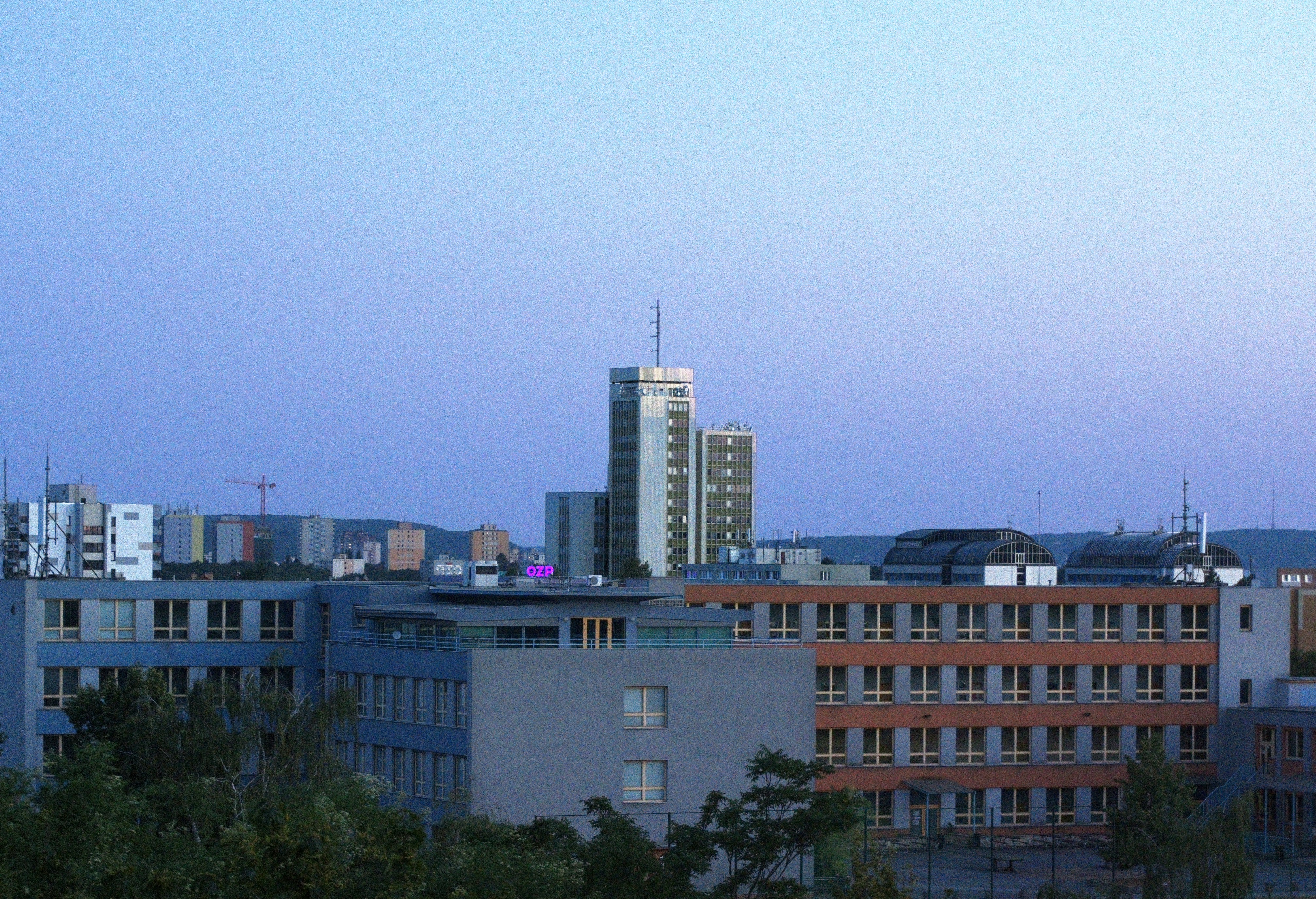 City Skyline at Dusk: A Quiet Riverside of Rectangles