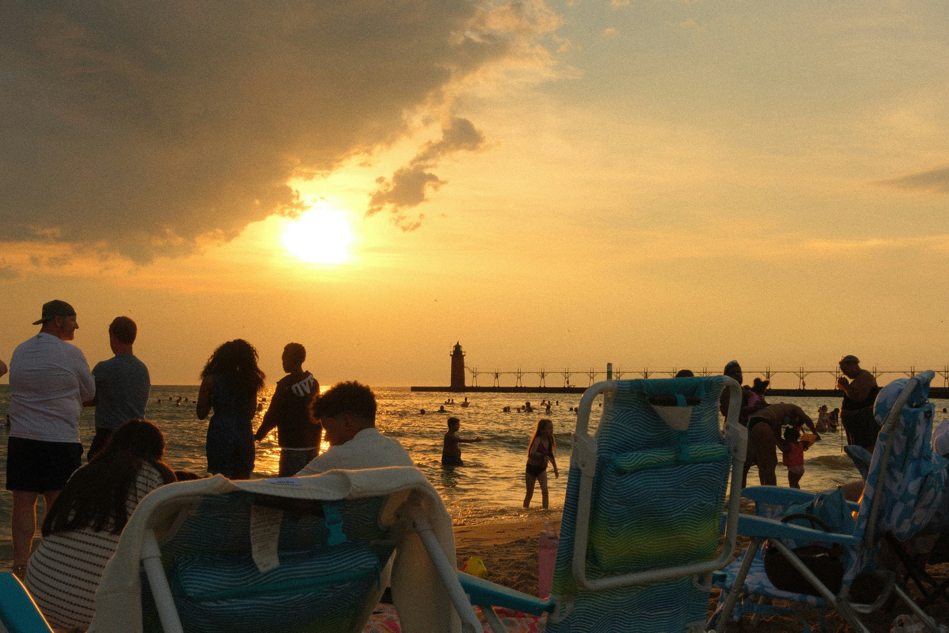 Sunset by the Beach: Faces and Loungers in Shared Silence