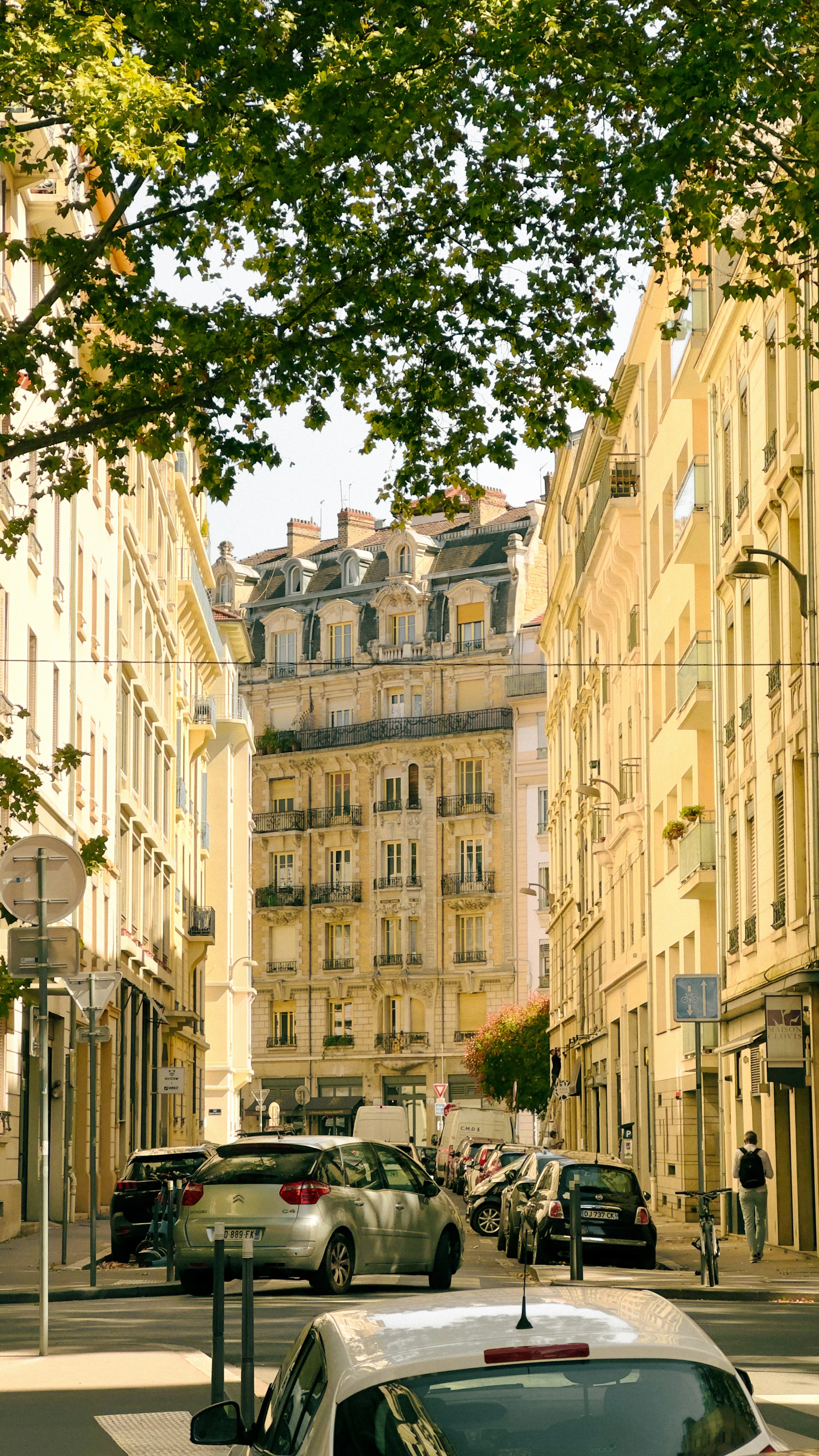 Sunlit Parisian Street: A Quiet Corridor Between Buildings
