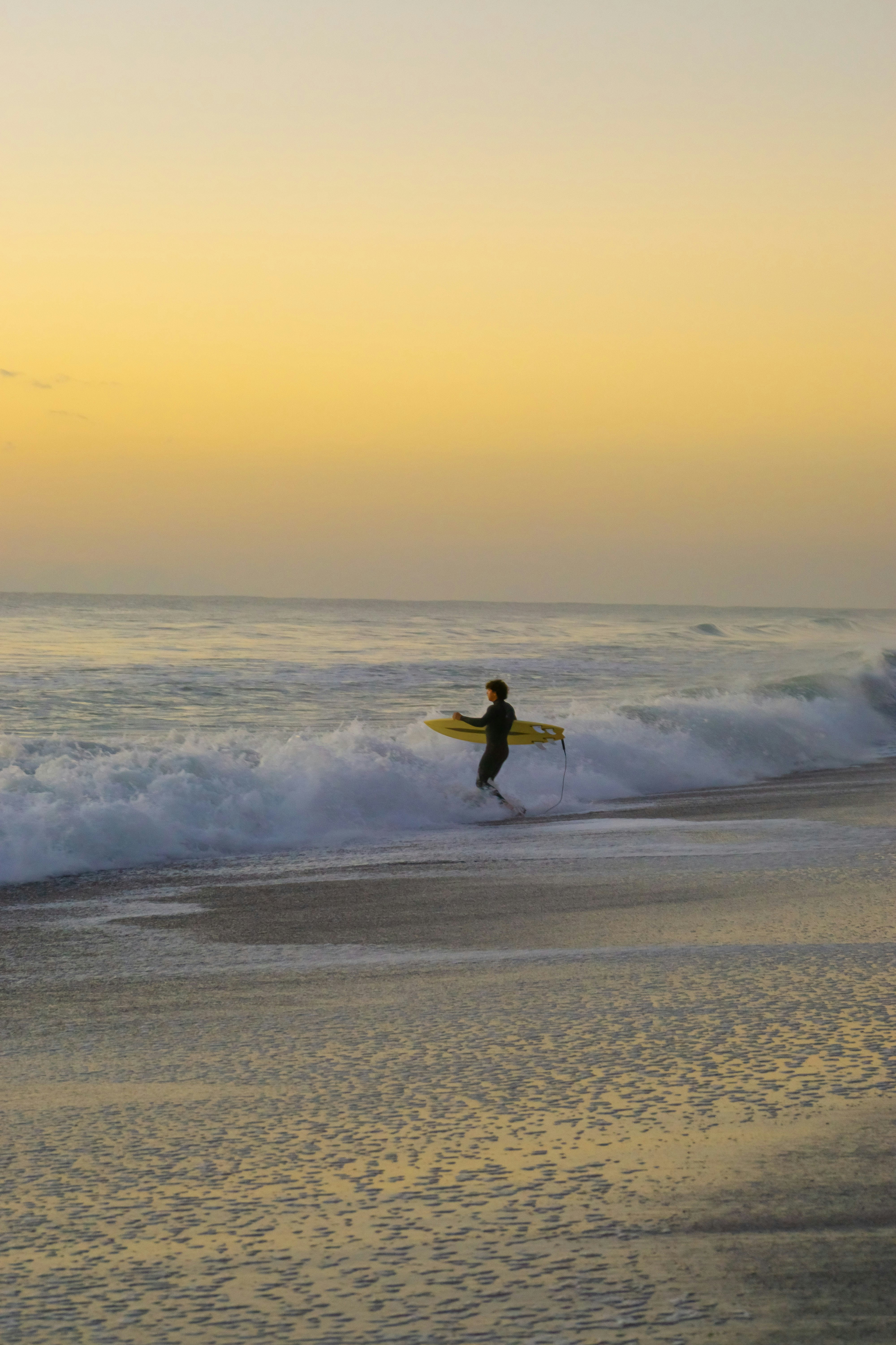 Golden Hour Surf Rider on a Quiet Shore