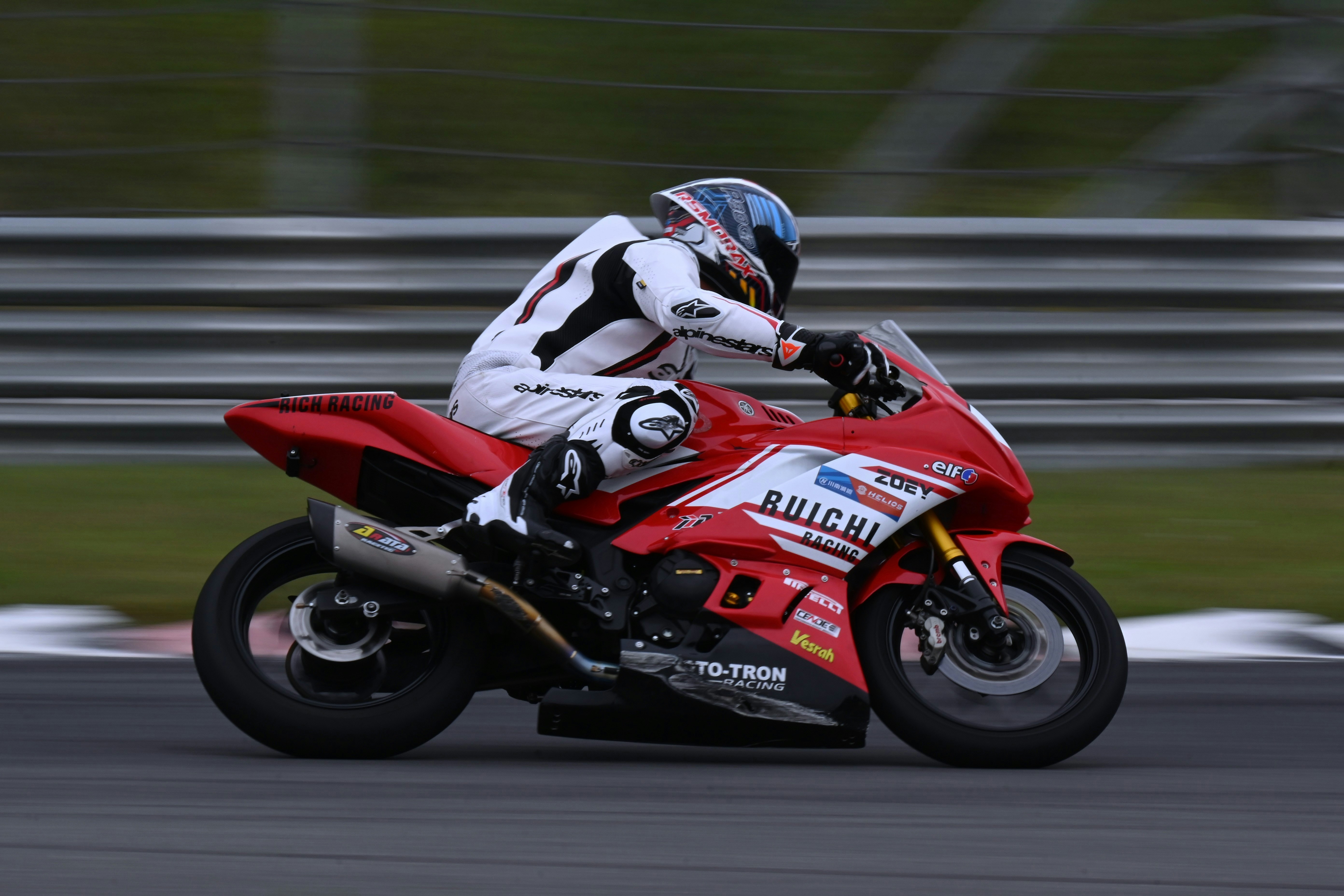 Racing Blur: Redbike Lean Through a Sharp Turn