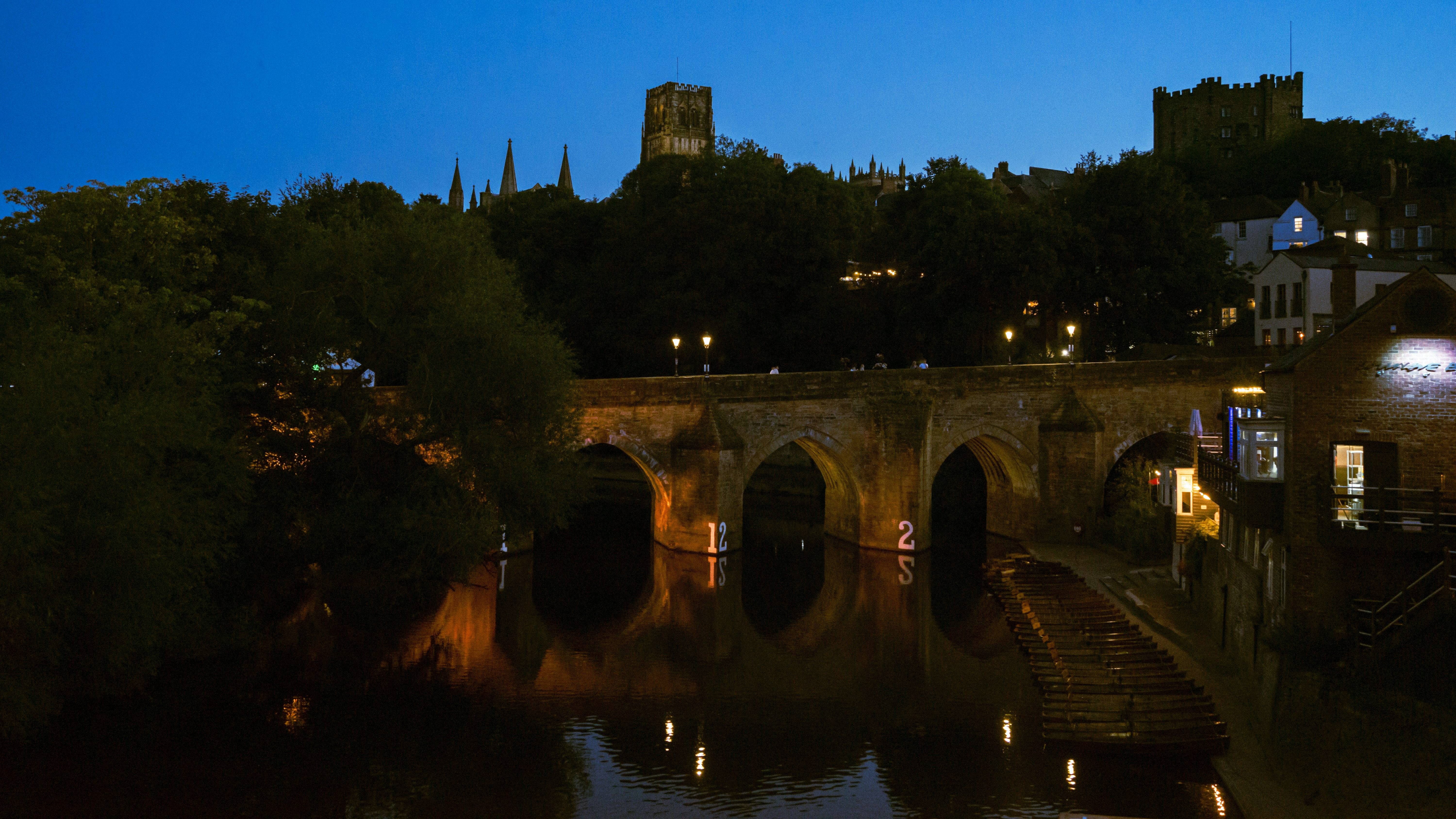 Moonlit Ponte Vecchio: Arched Bridge over Quiet Canal at Dusk
