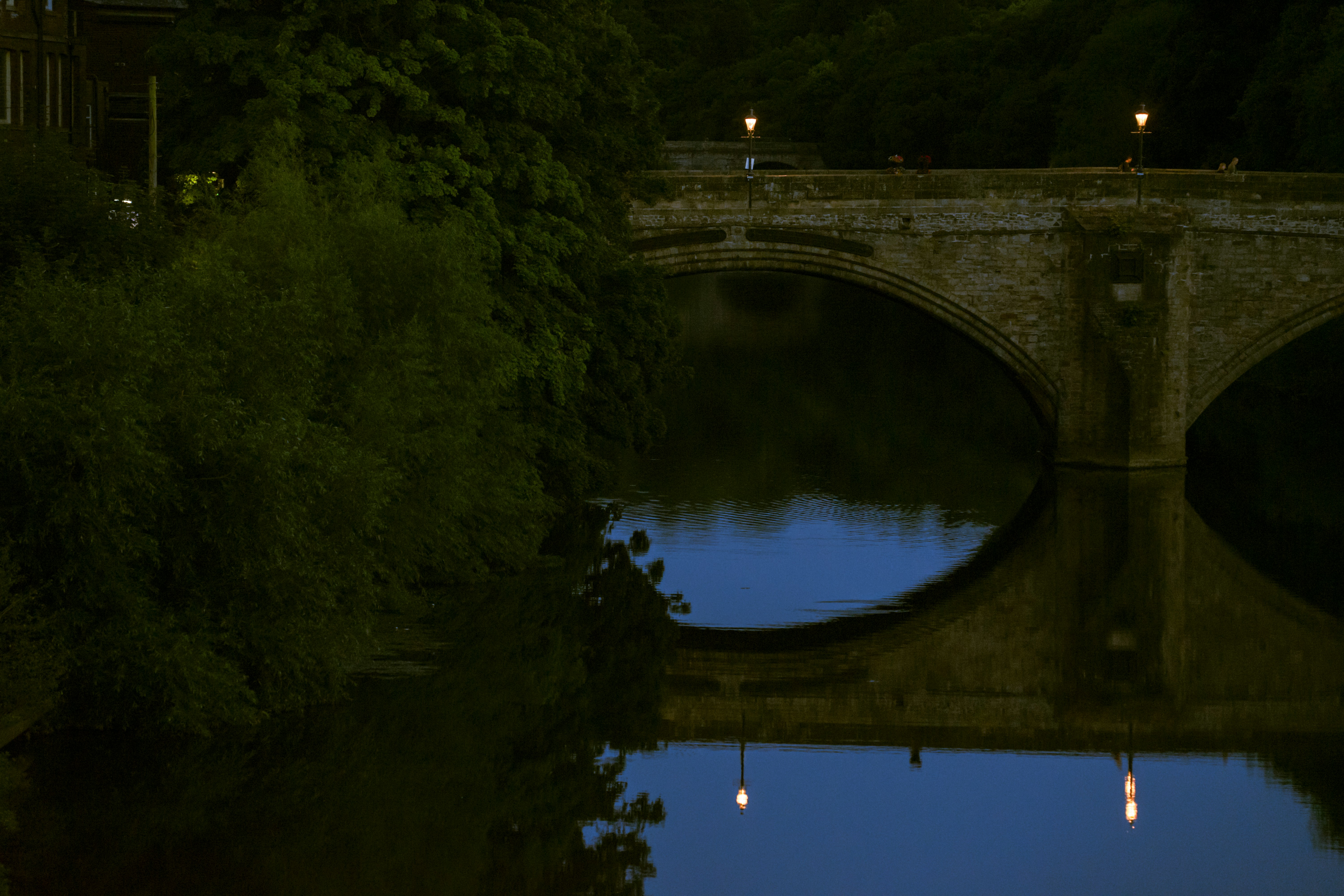 Moonlit Arch: A Quiet Night Over the River