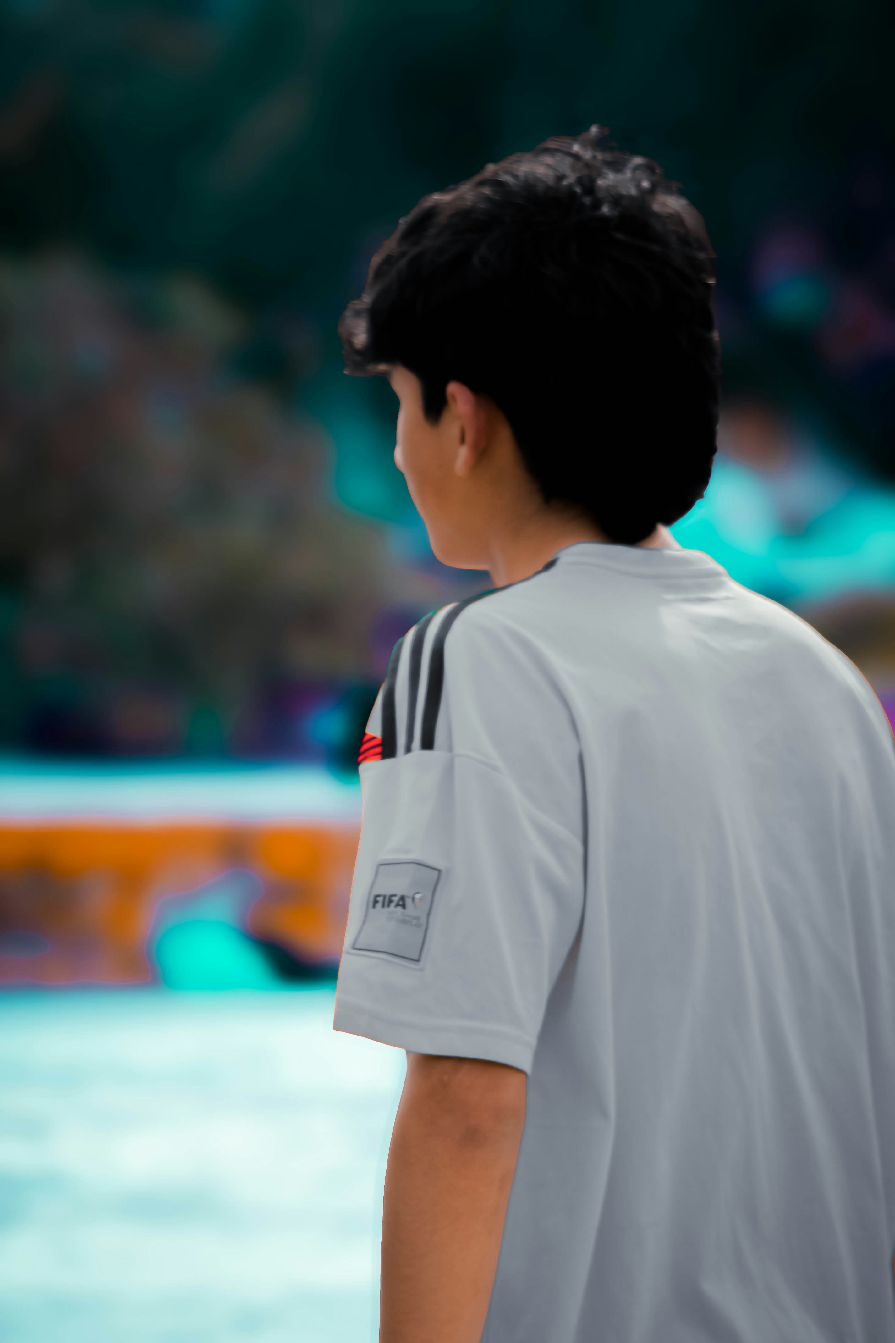 Back Turned: A Solitary Athlete in Soft Focus at the Edge of the Pool
