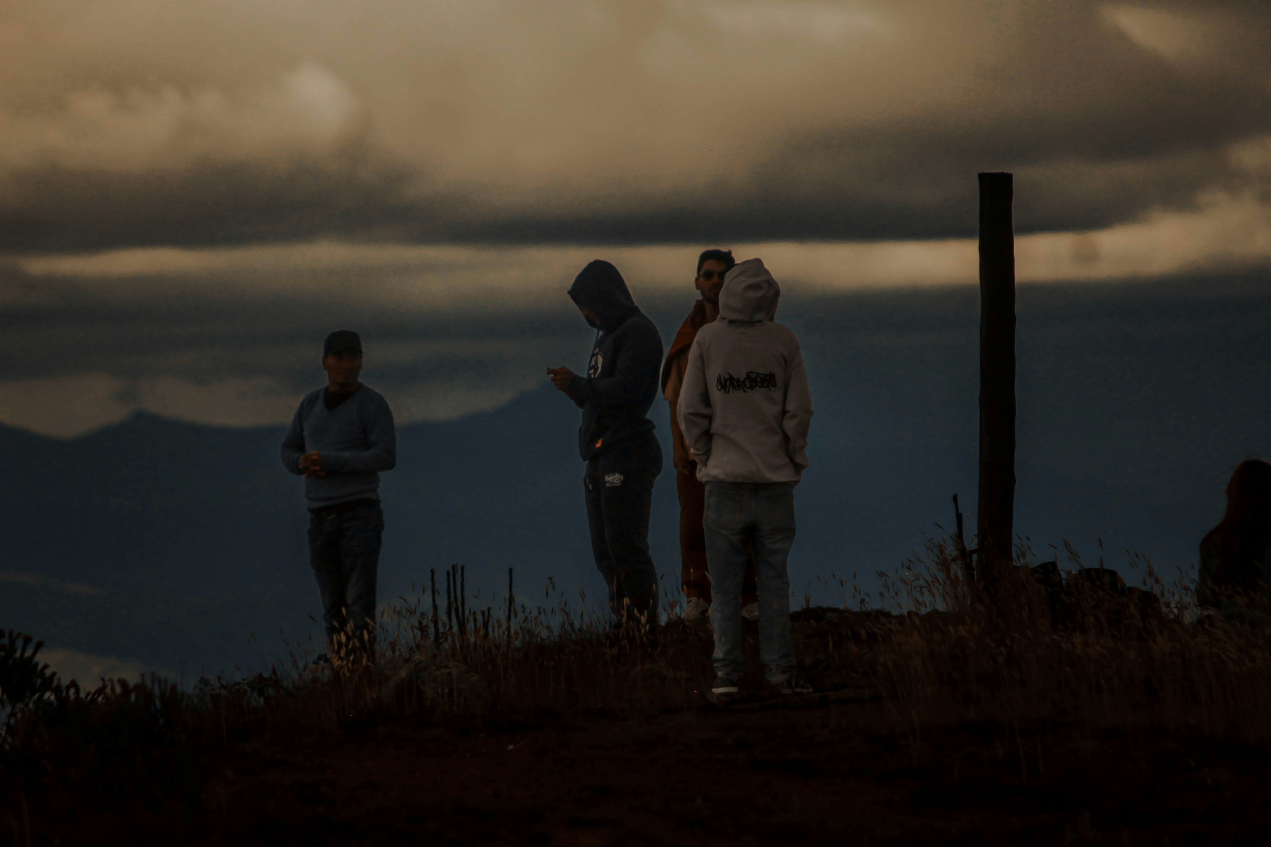 Dusk Silhouettes on a Wind-Swept Ridge