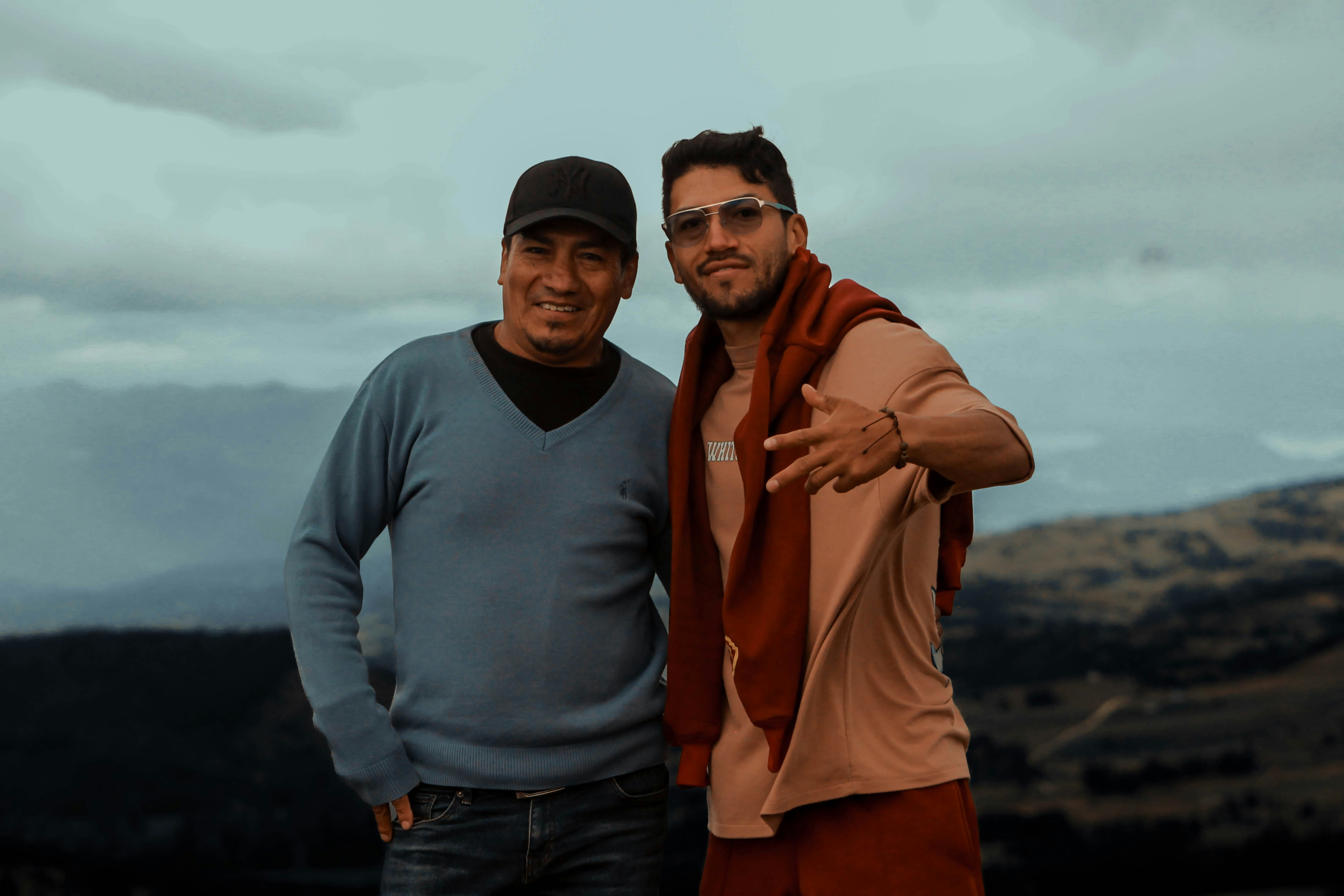 Two Friends Shoulder-to-Shoulder Under Expansive Skies