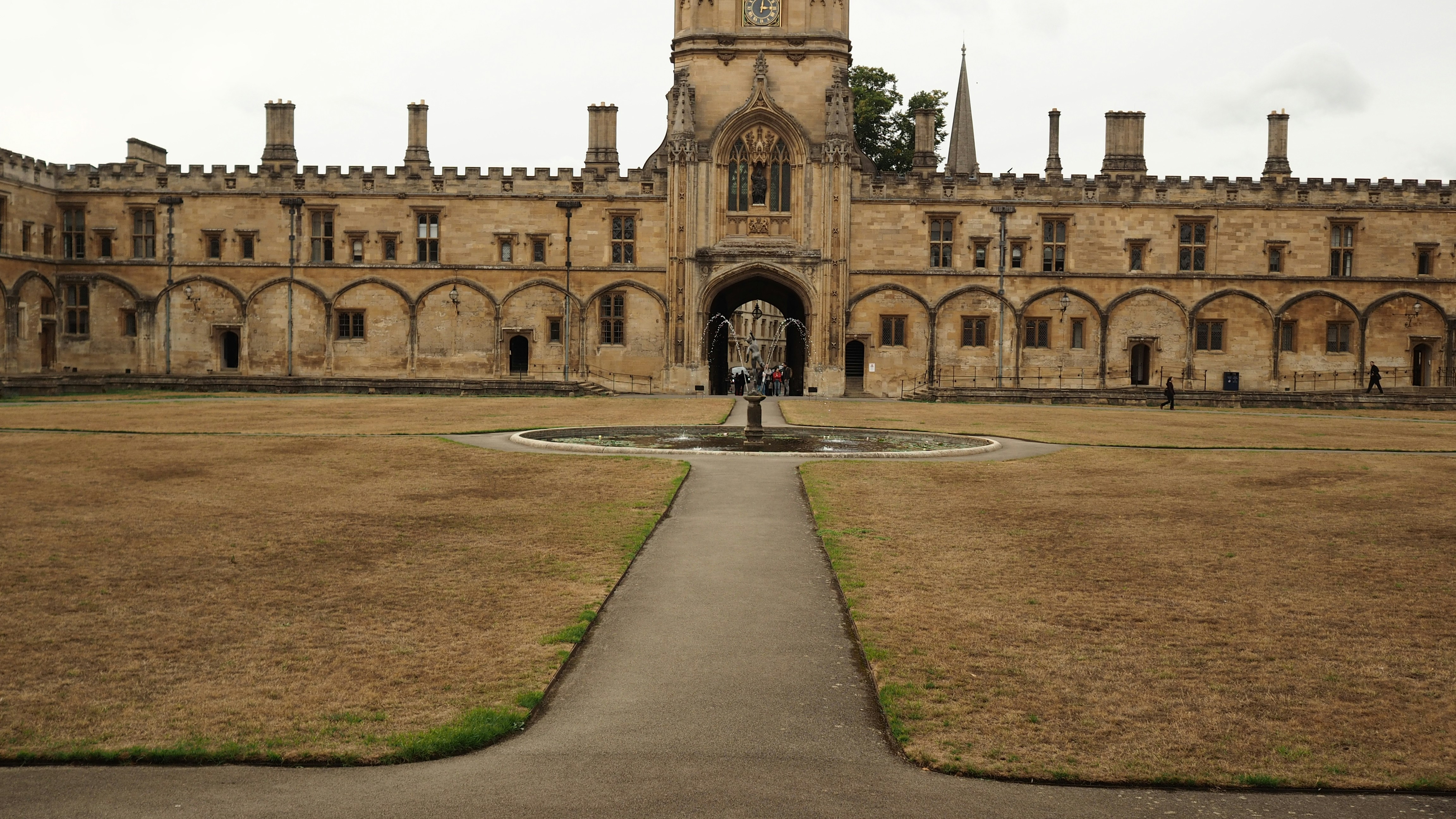 City Gate in Stone Courtyard: A Quiet Approach to a Medieval Entrance