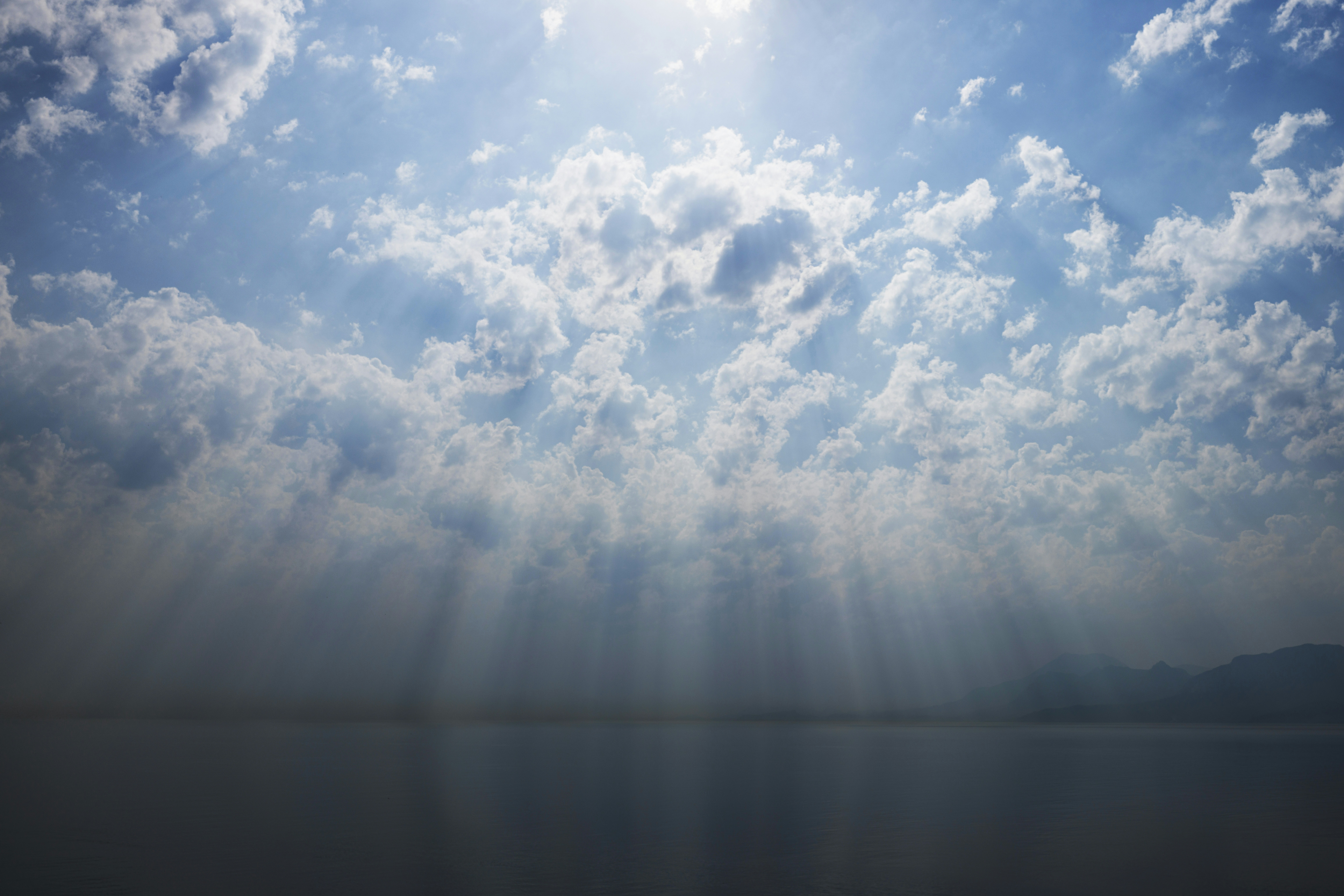 Sunbeams Break Over a Silent Lake