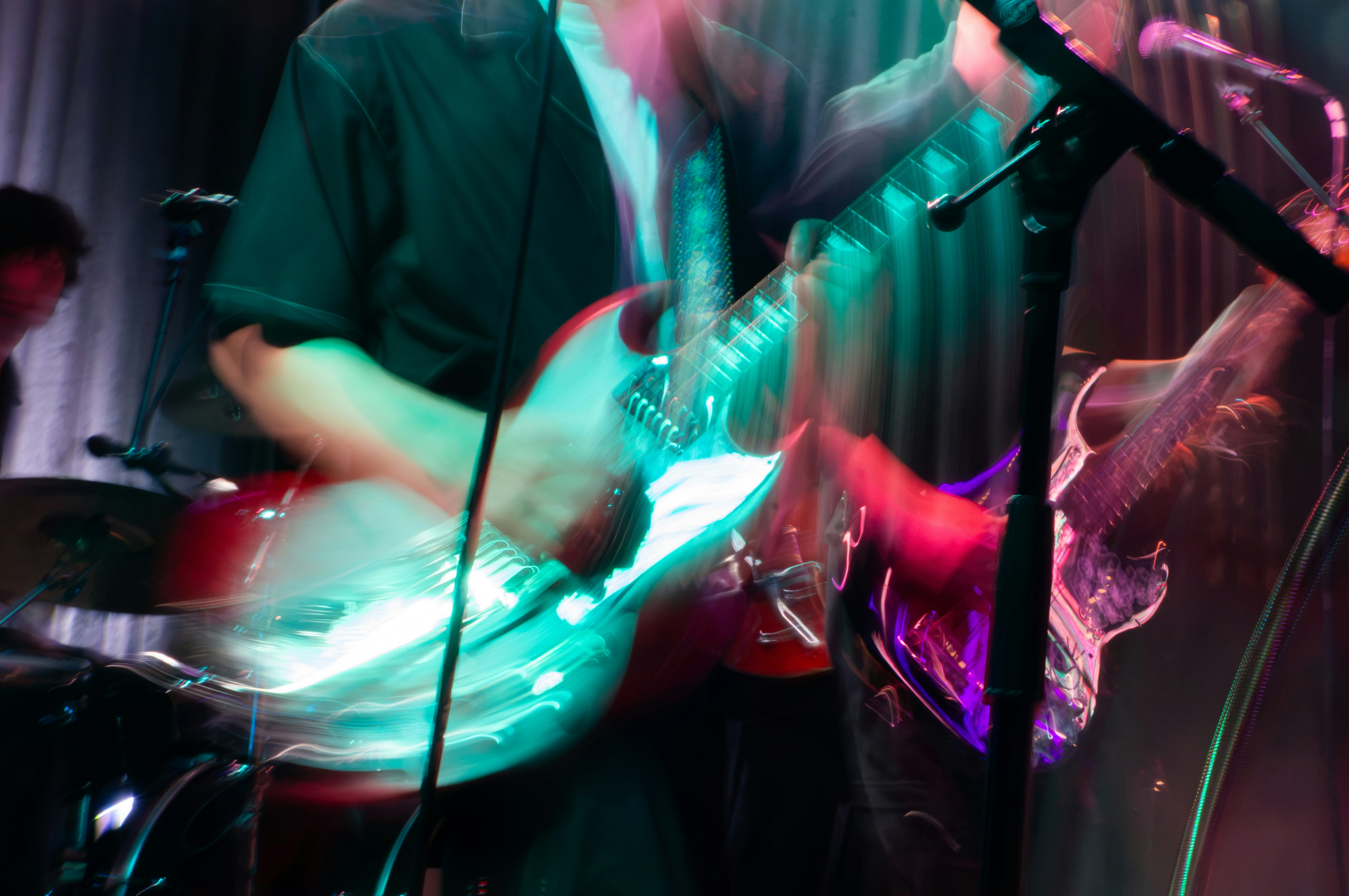 Motion in Neon Strings: A Night of Blurred Guitar Lines