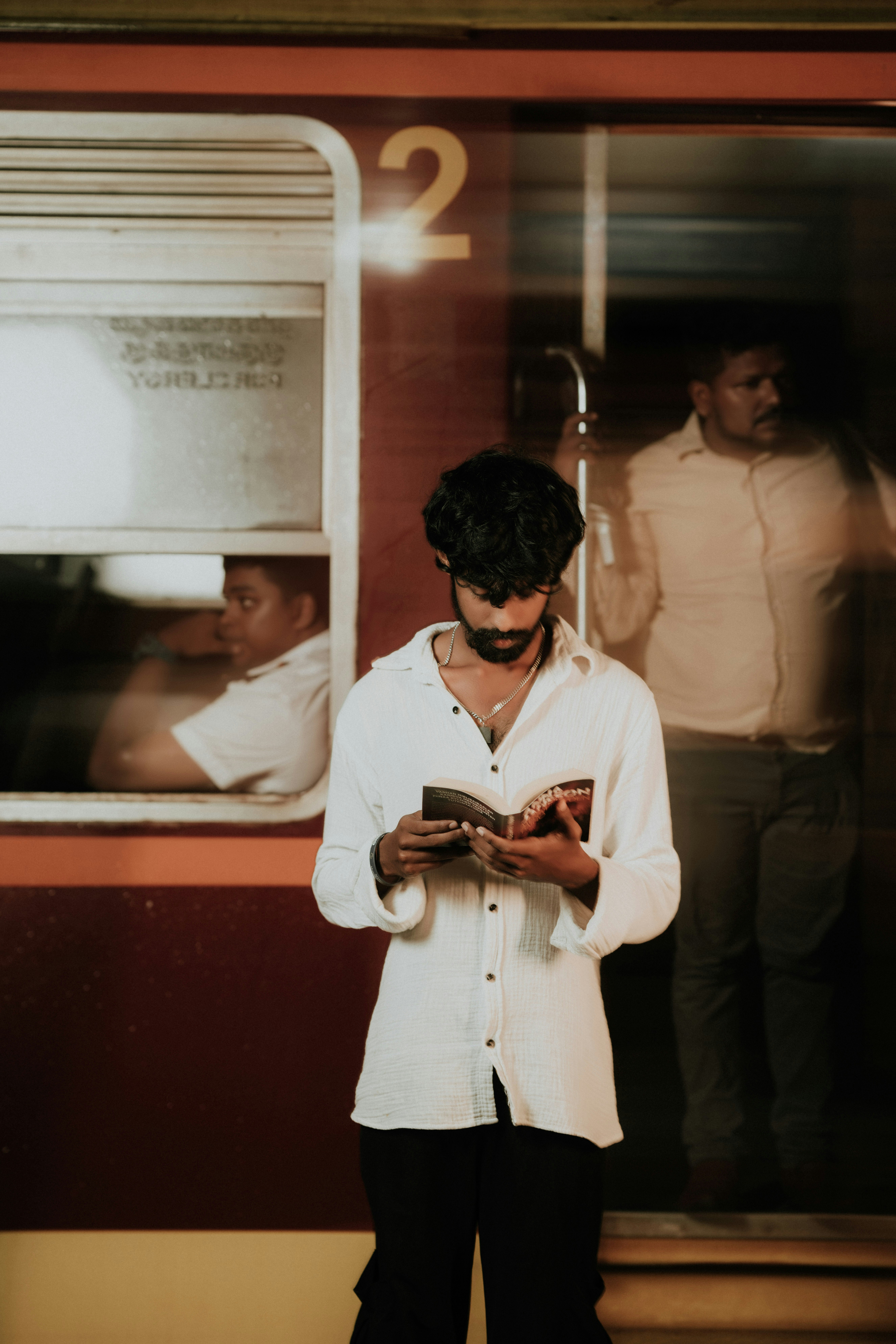 Reading in Motion: A Reader in Front of the Moving Train