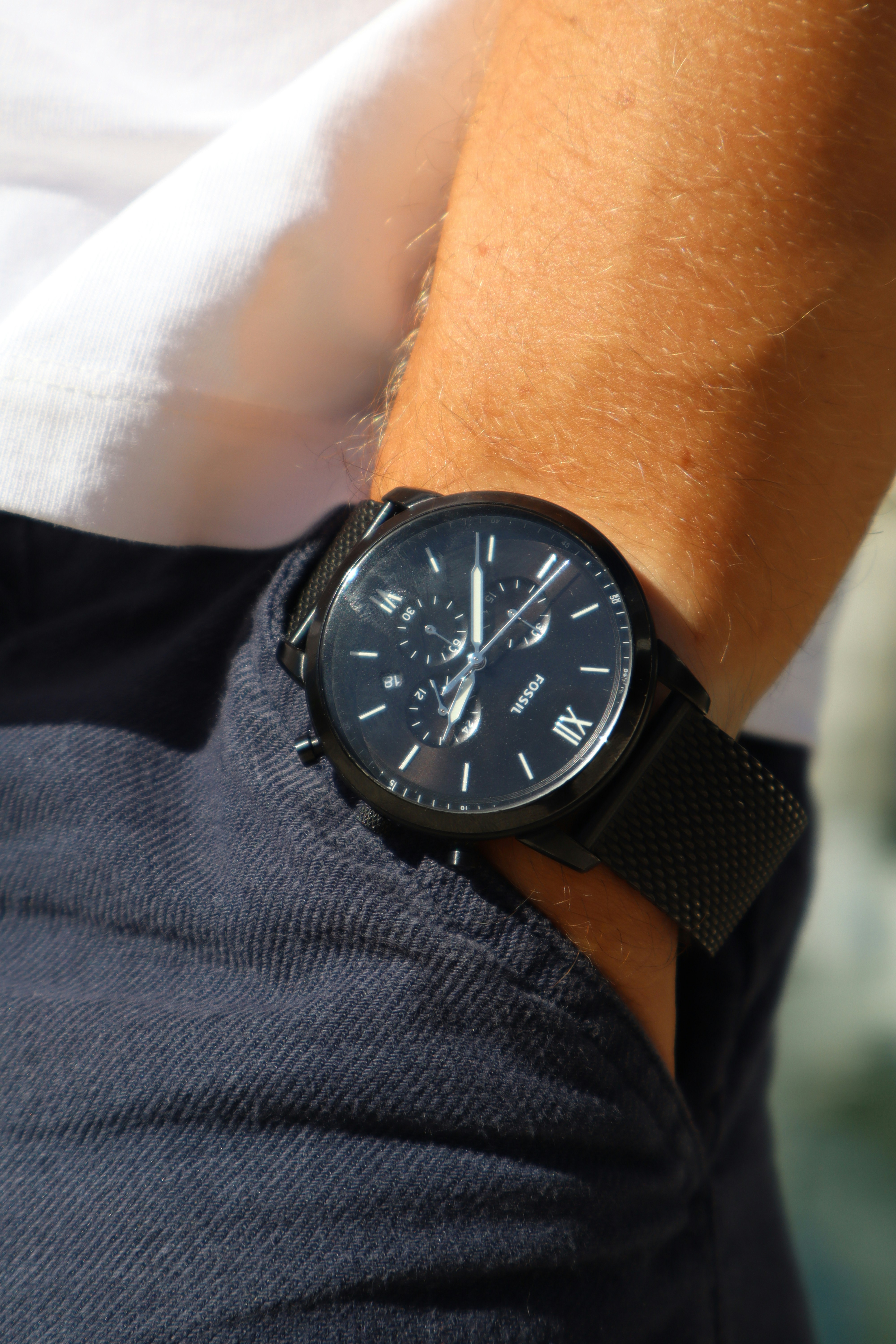 Black Chronograph on Tanned Wrist: A Casual Daytime Shot