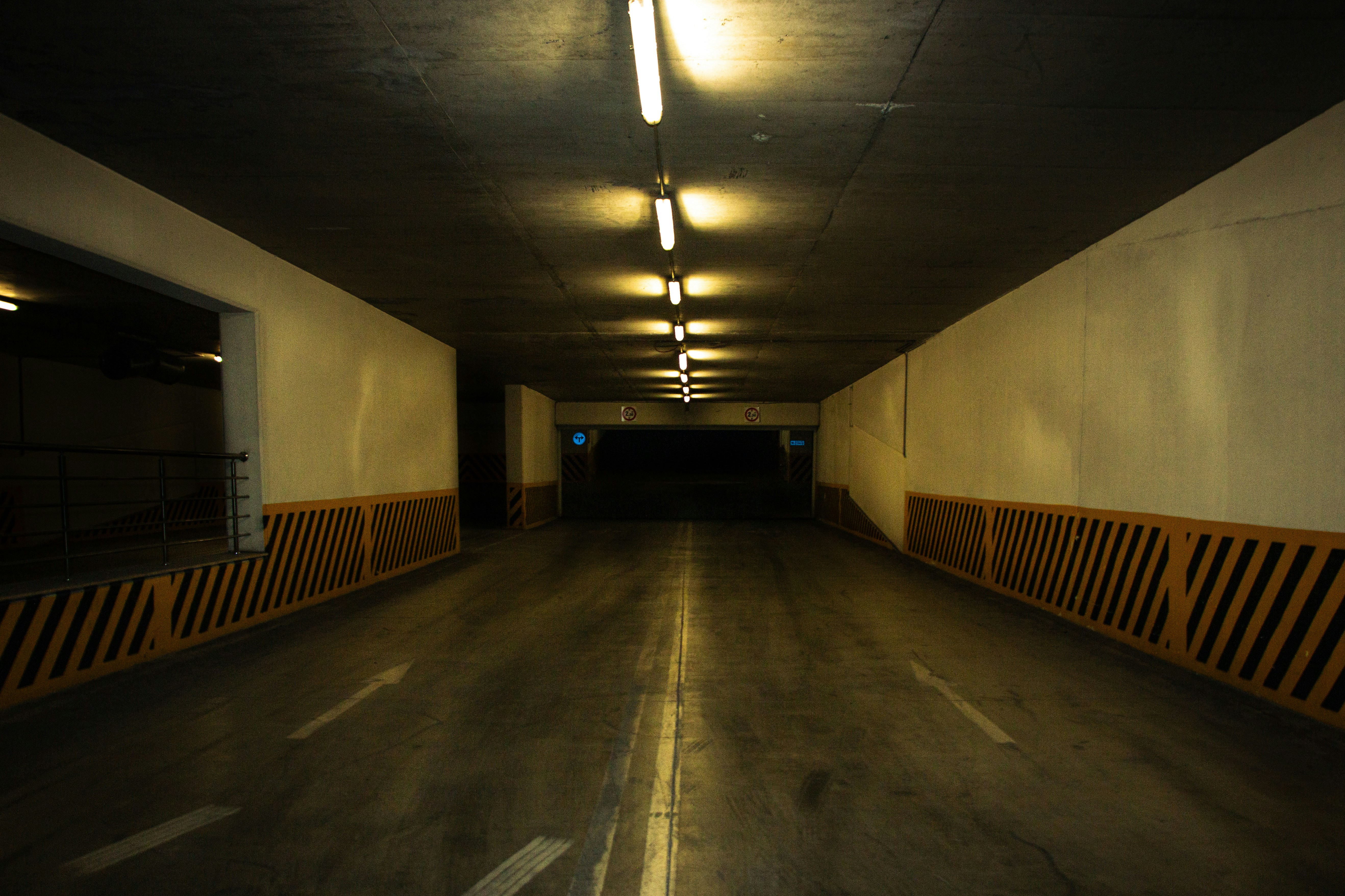 Underground Lane: Halogen Lines Recede into the Quiet Dusk