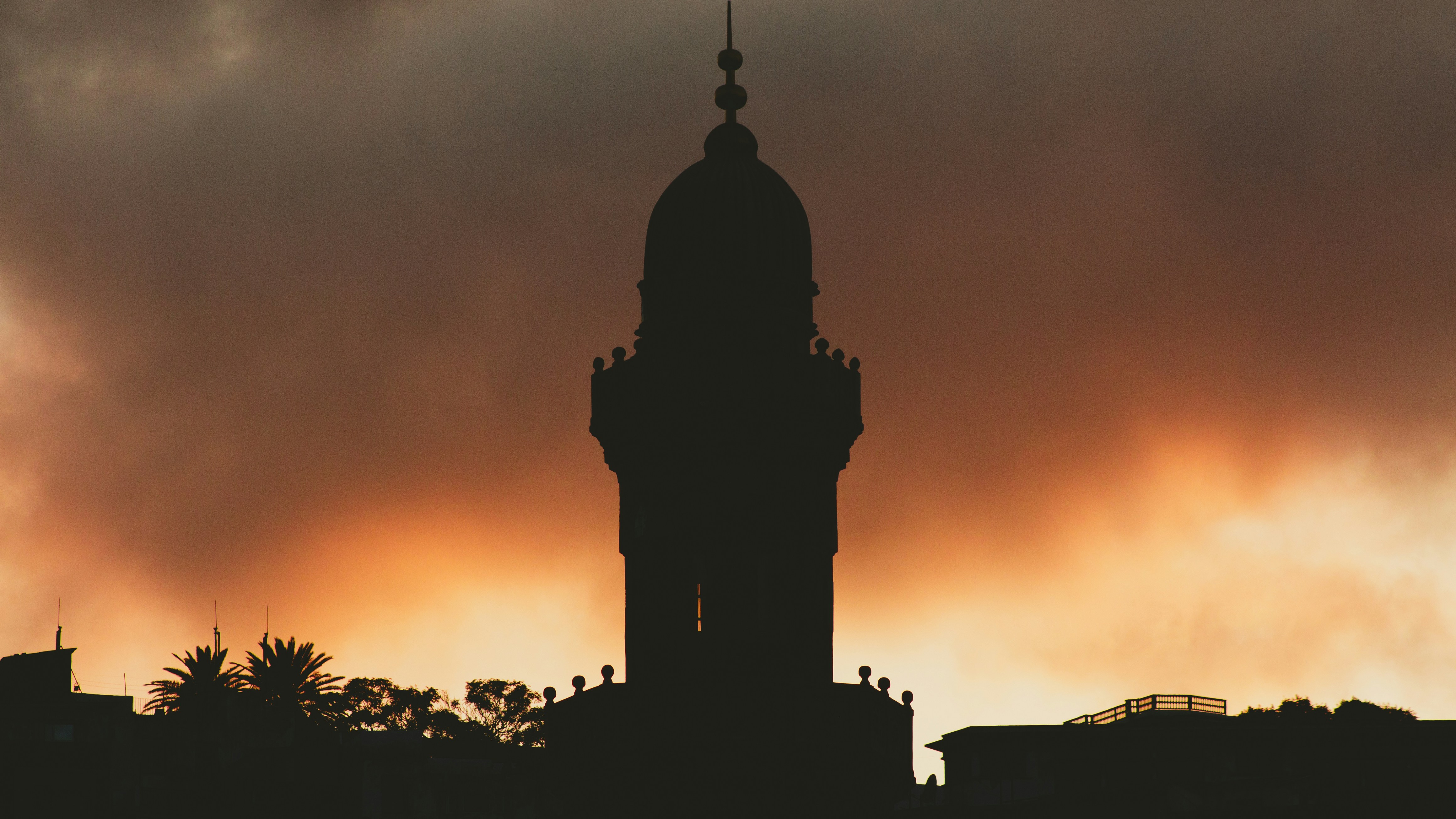 Silhouette at Sunset: The Clock Tower against a Fiery Sky