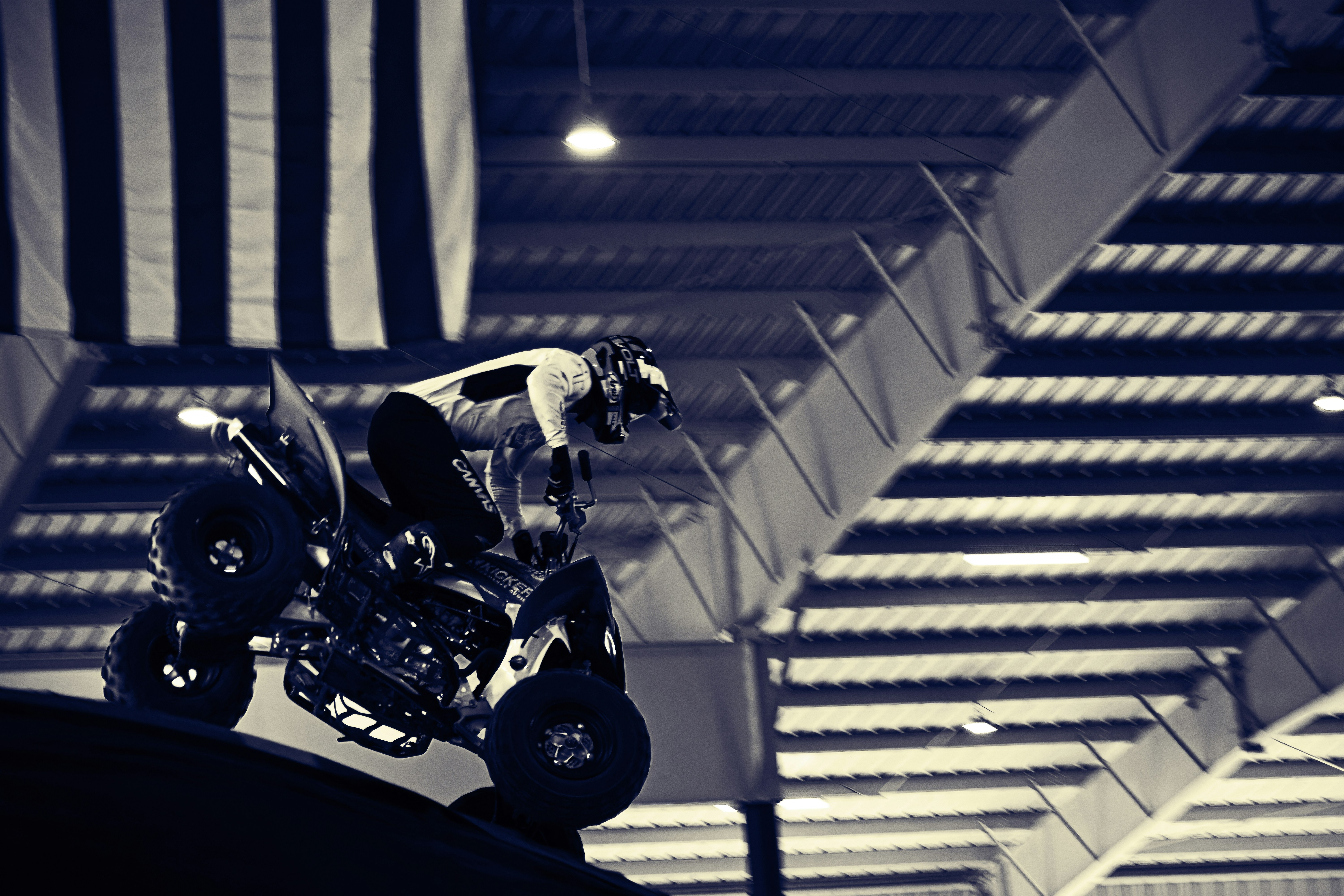 Midair Motorcycle: Aerial stunt over an industrial backdrop