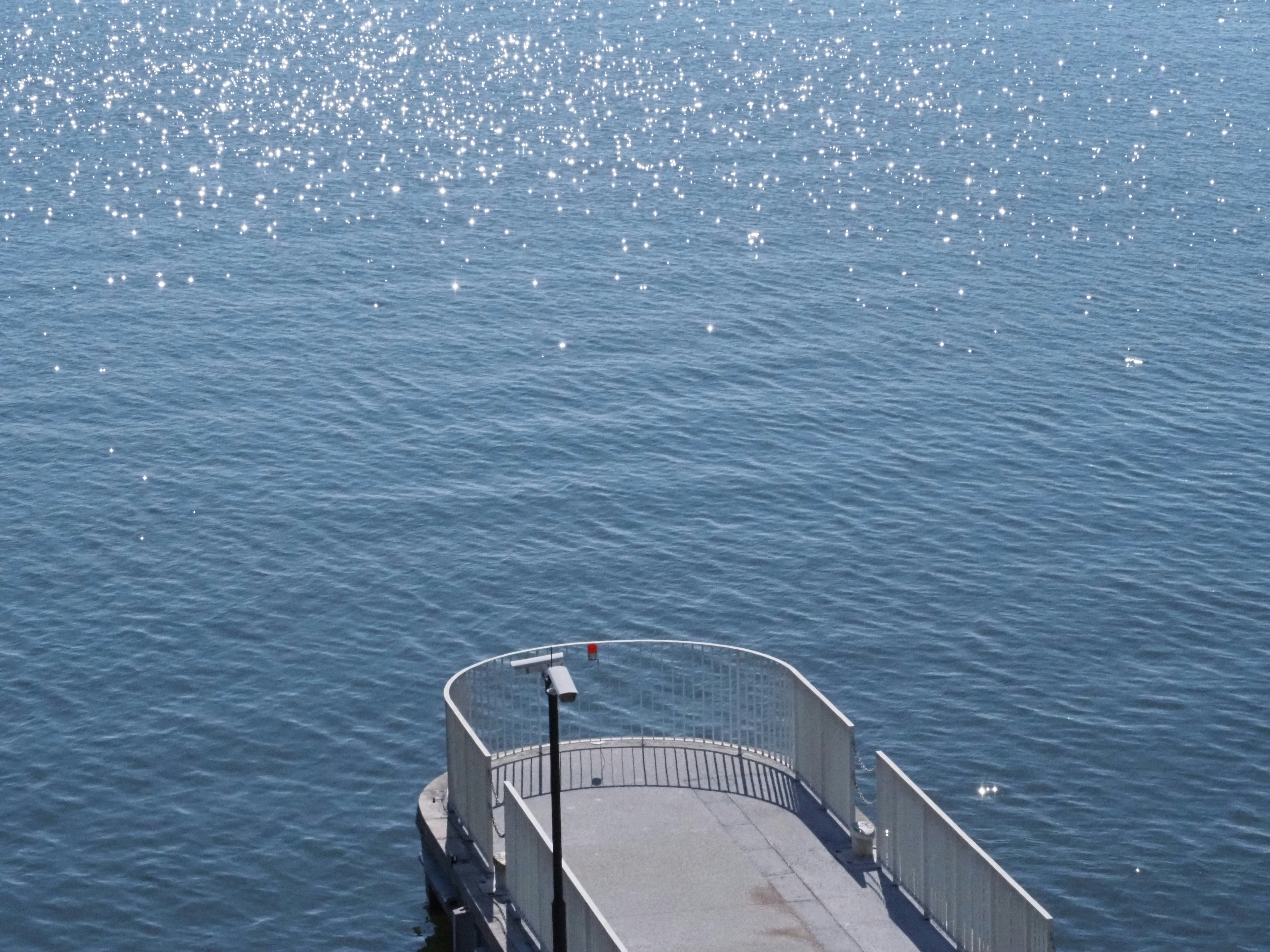 Pier End at Sea: Quiet Platforms and Sparkling Light
