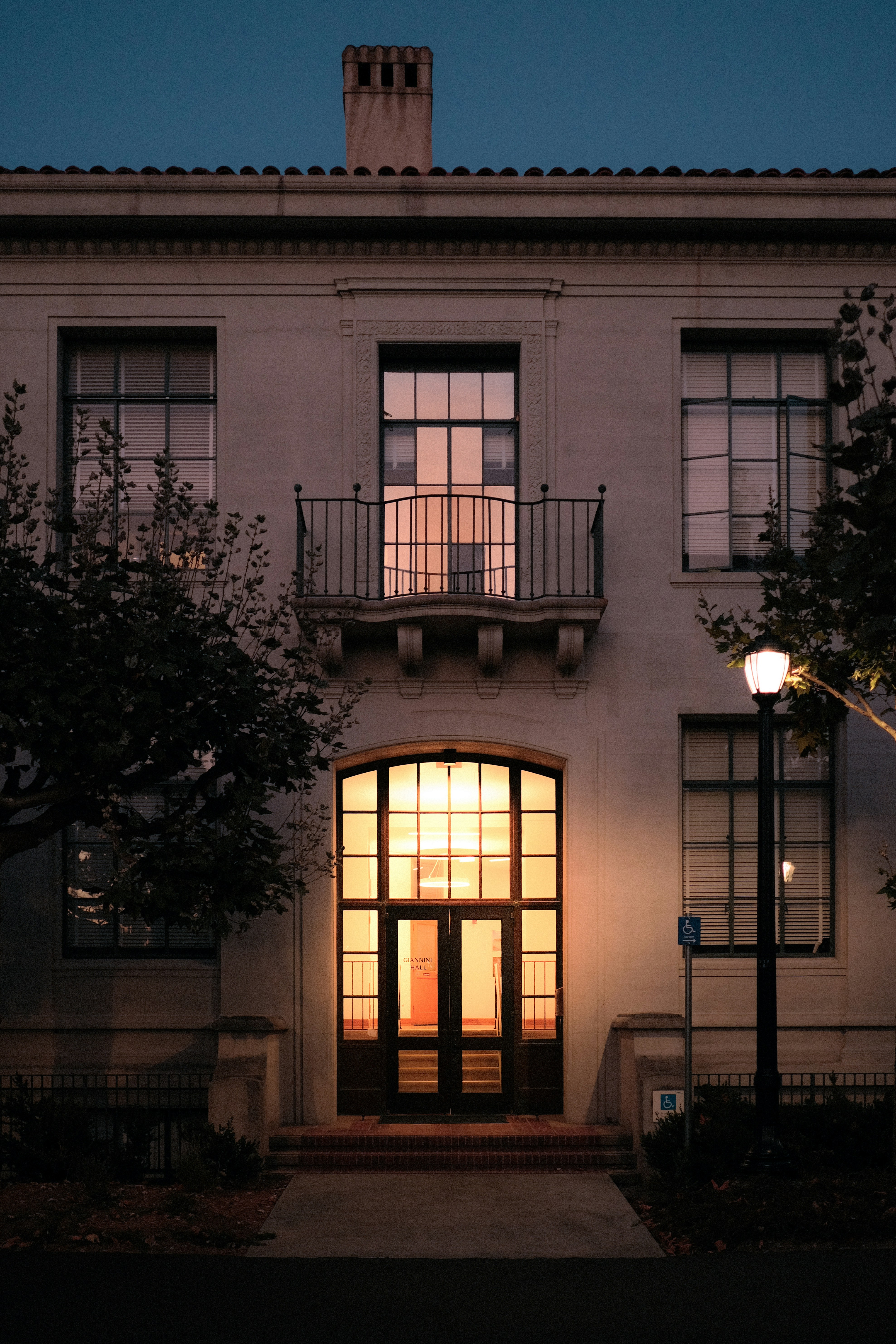 Warm Light at the Entrance: Evening Glow on a Classic Facade