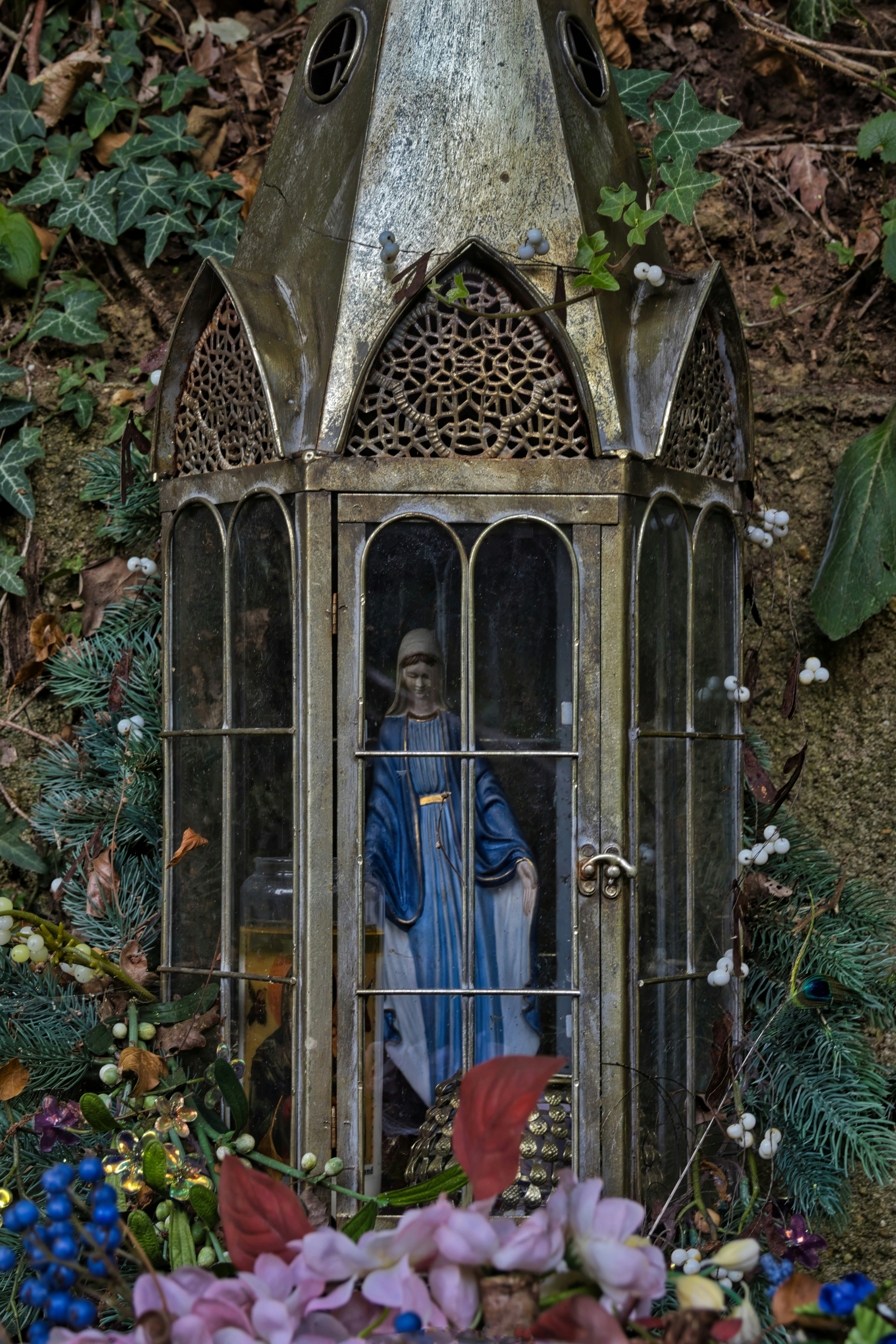 Ivory Lantern Shrine: A Figure in Blue Within a Glasshouse of Ivy