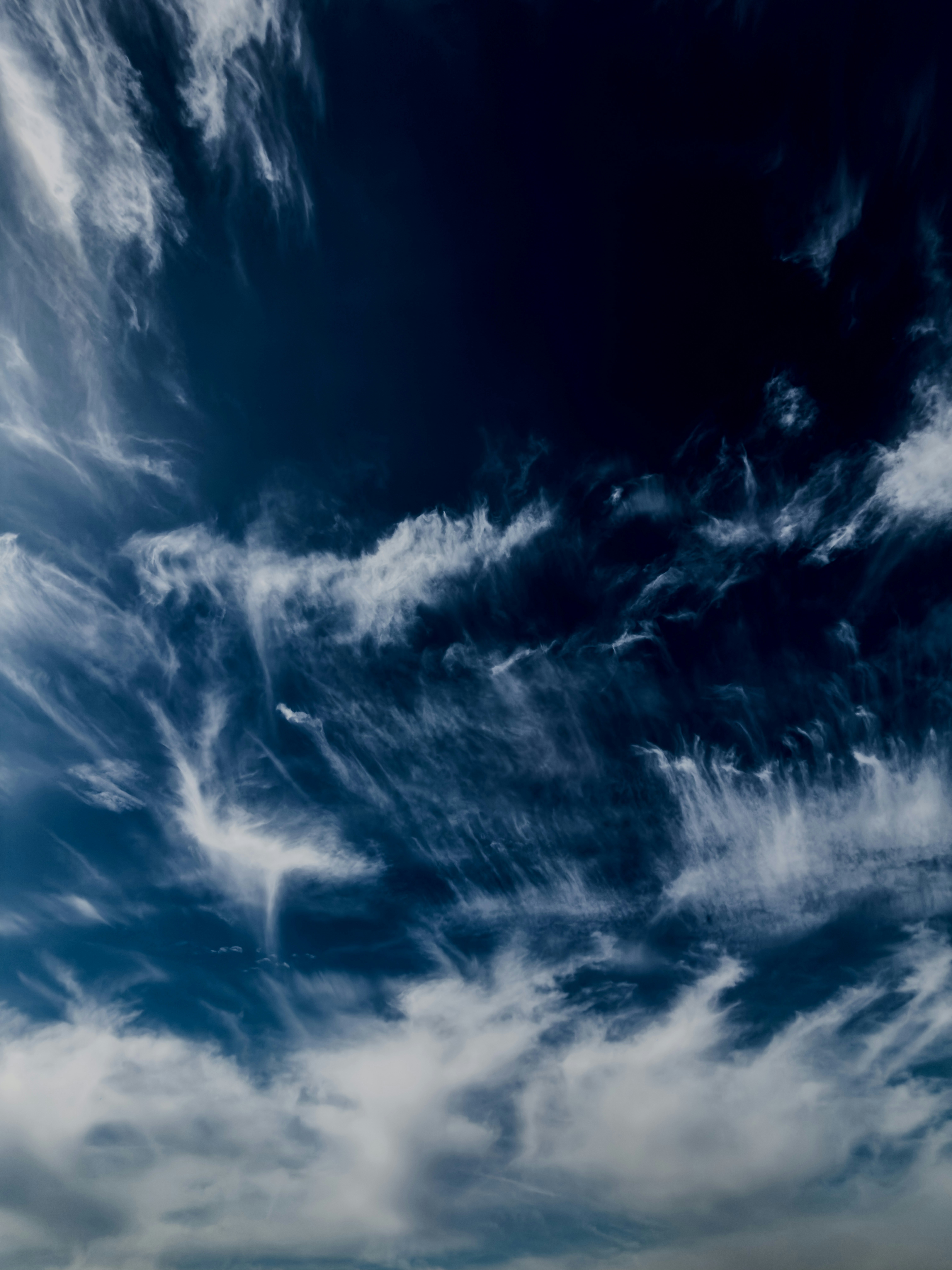 Veil of Cirrus over Deep Blue Sky