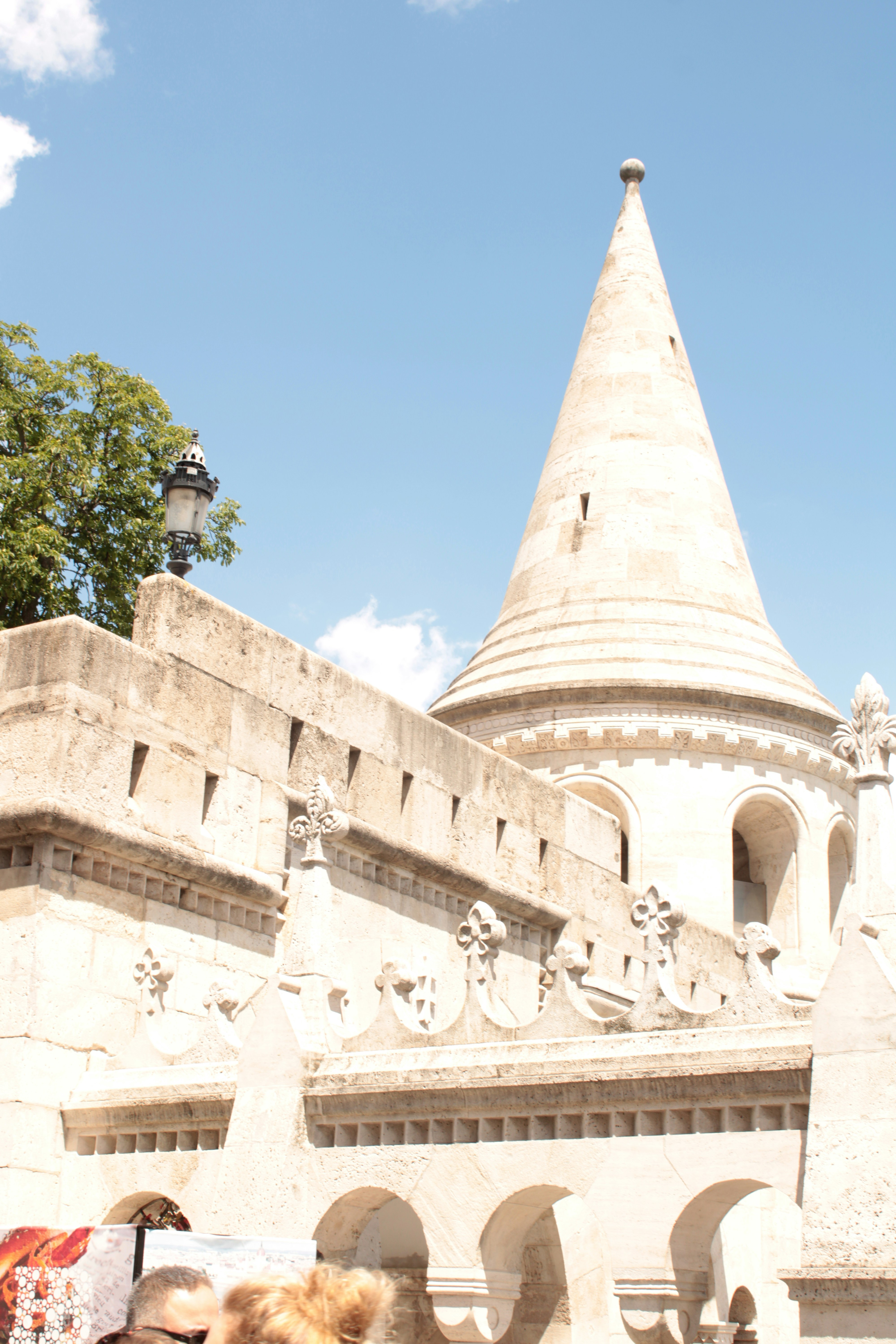 Conical Turret Above a Carved Stone Terrace under a Clear Sky