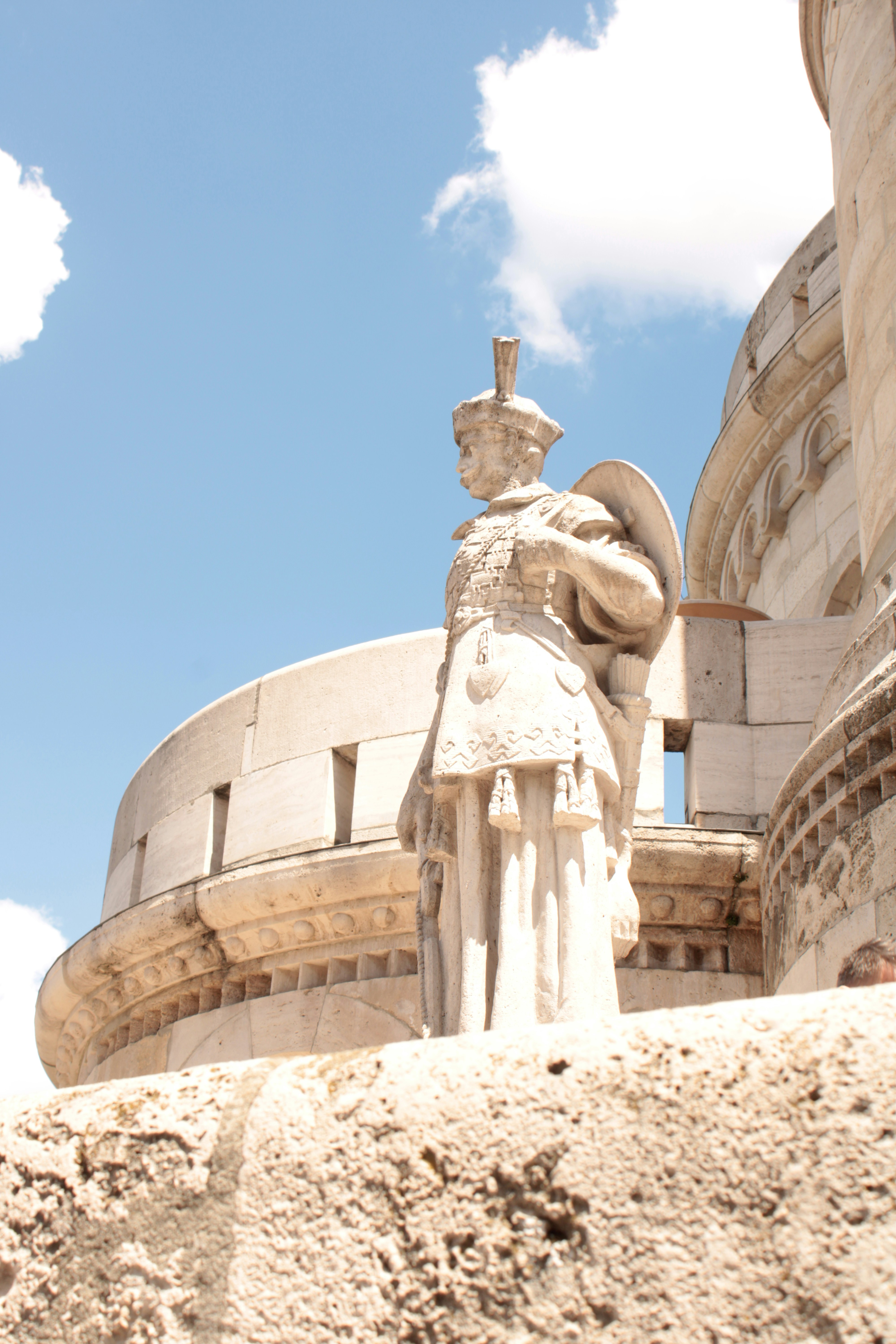 Stone Sentinel: A Knightly Figure Guarding the Circular Terrace