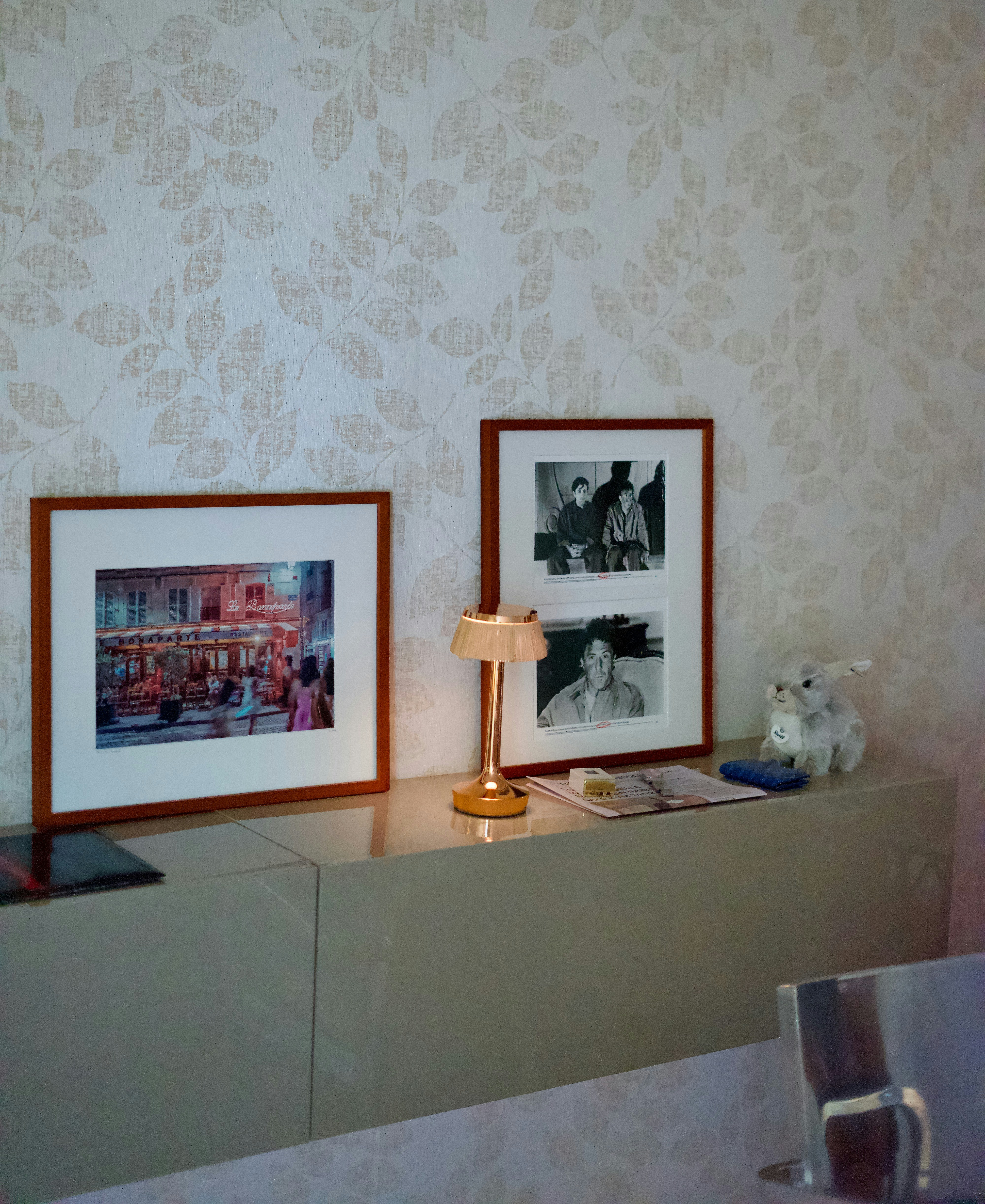 Gentle Portrait on a Display Shelf: Framed Memories and Soft Light