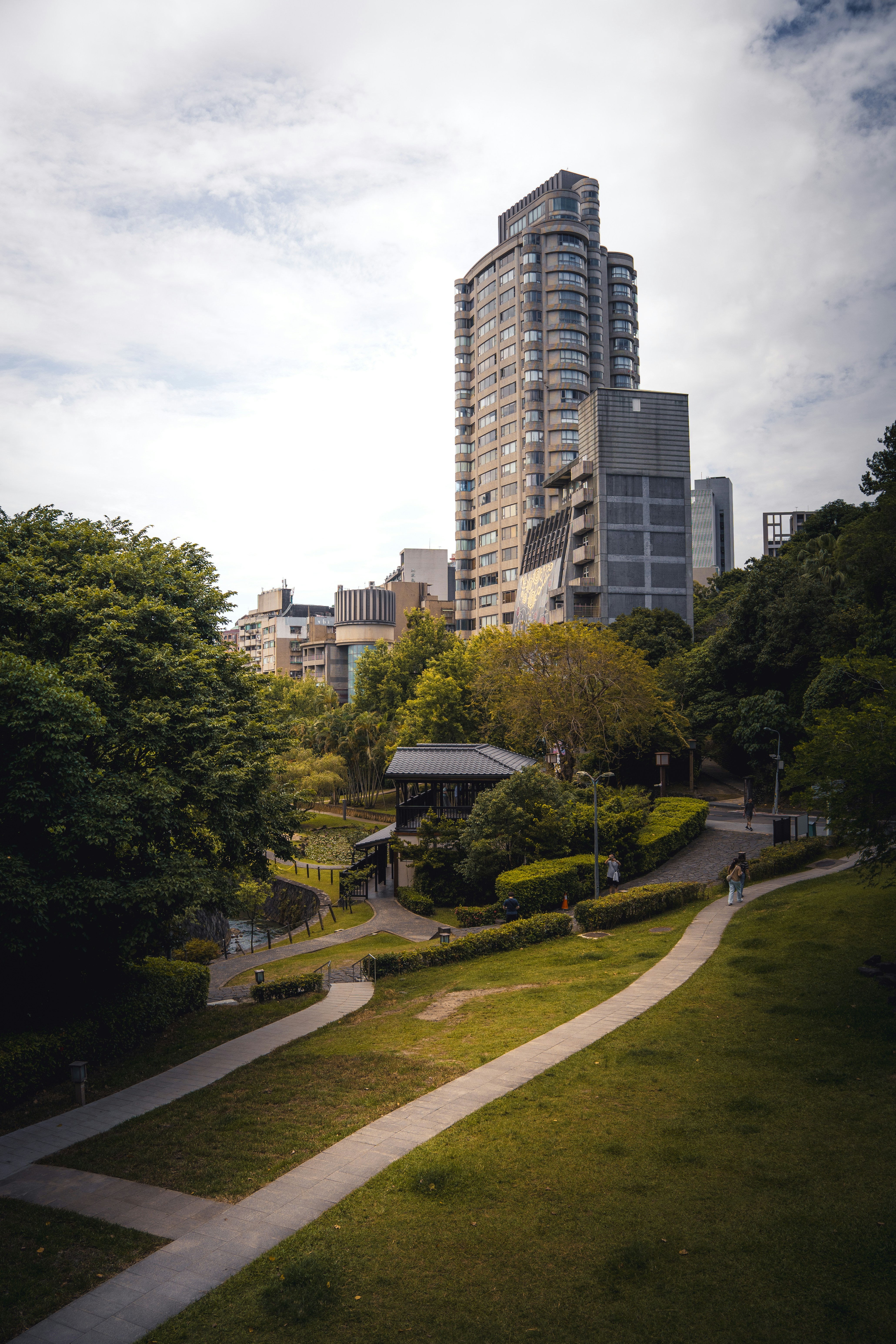 Skyline Serenade: Concrete Towers Over a Quiet Park