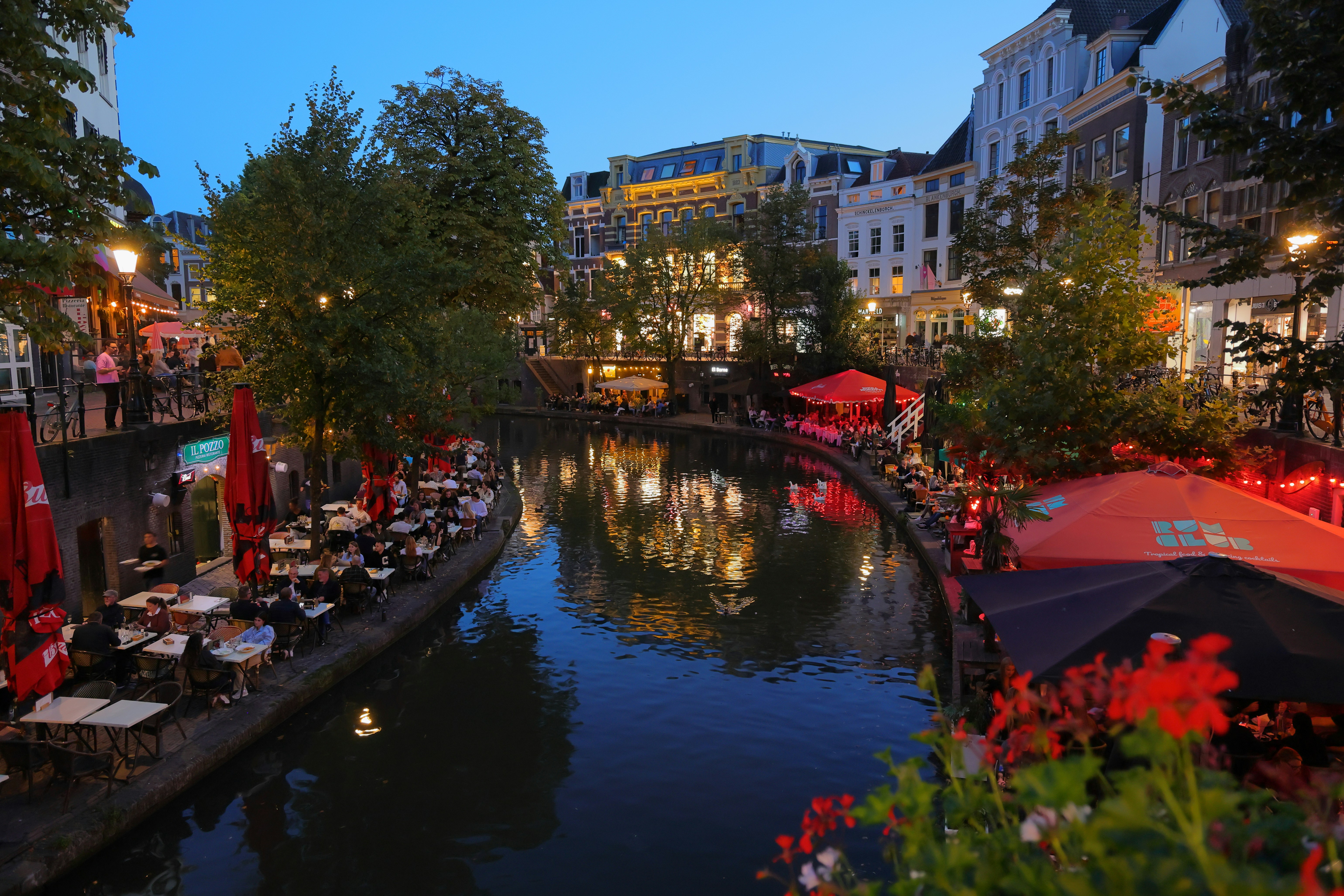 Canal-side Evening Amid Terrace Cafés and Reflections
