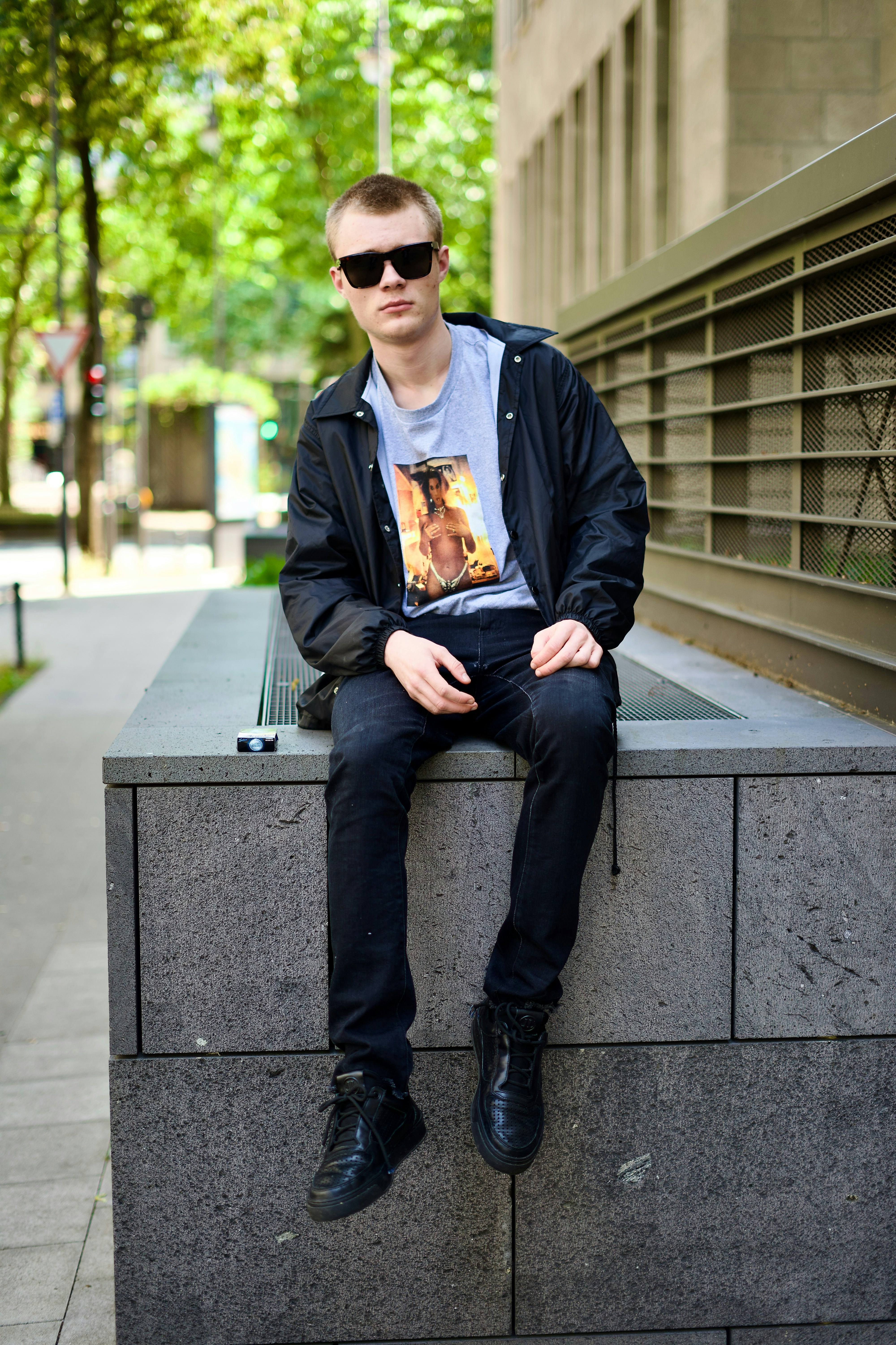 Urban Quiet: A Youthful Moment on a City Bench
