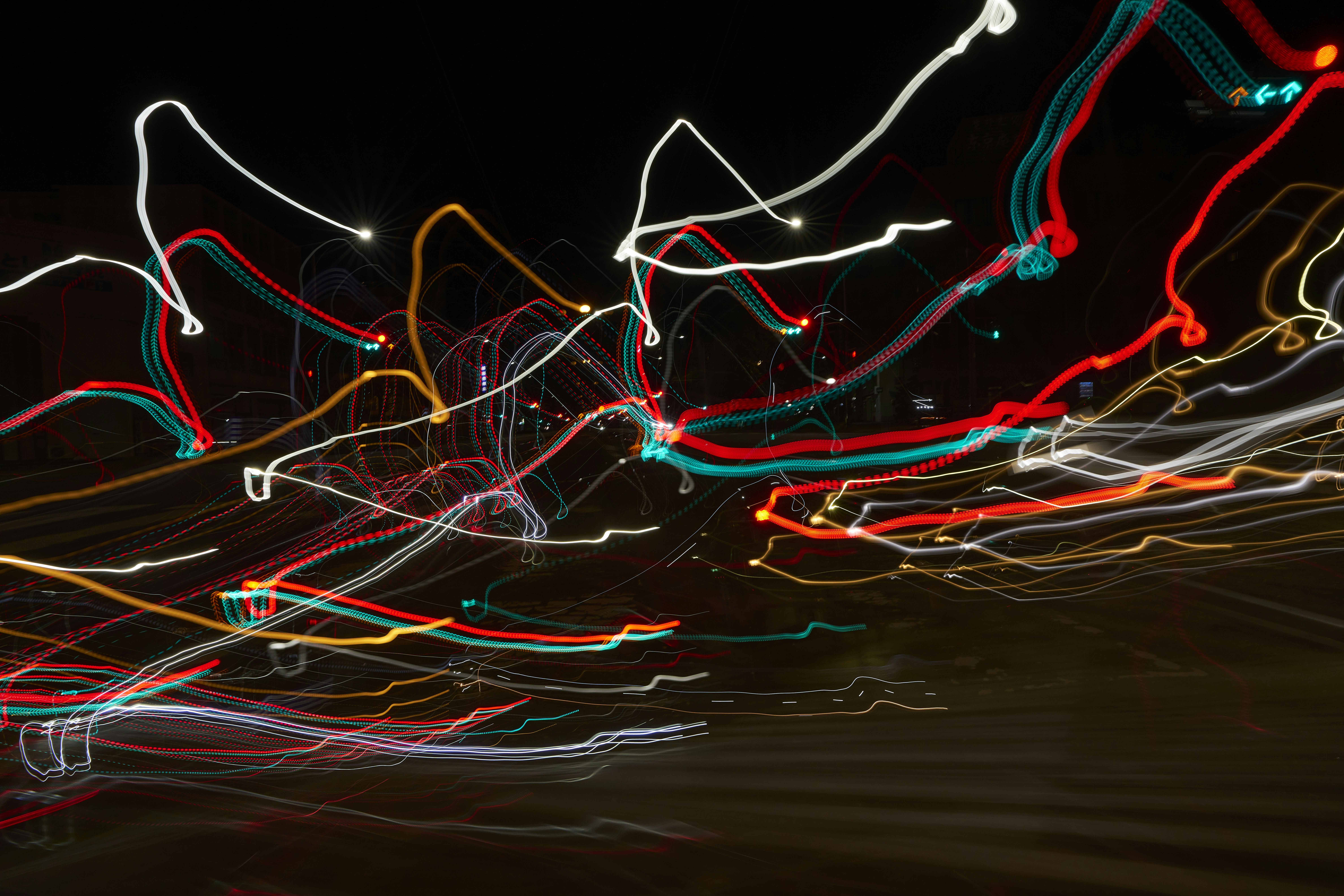 Nocturne in Motion: Neon Trails Across a Cityscape