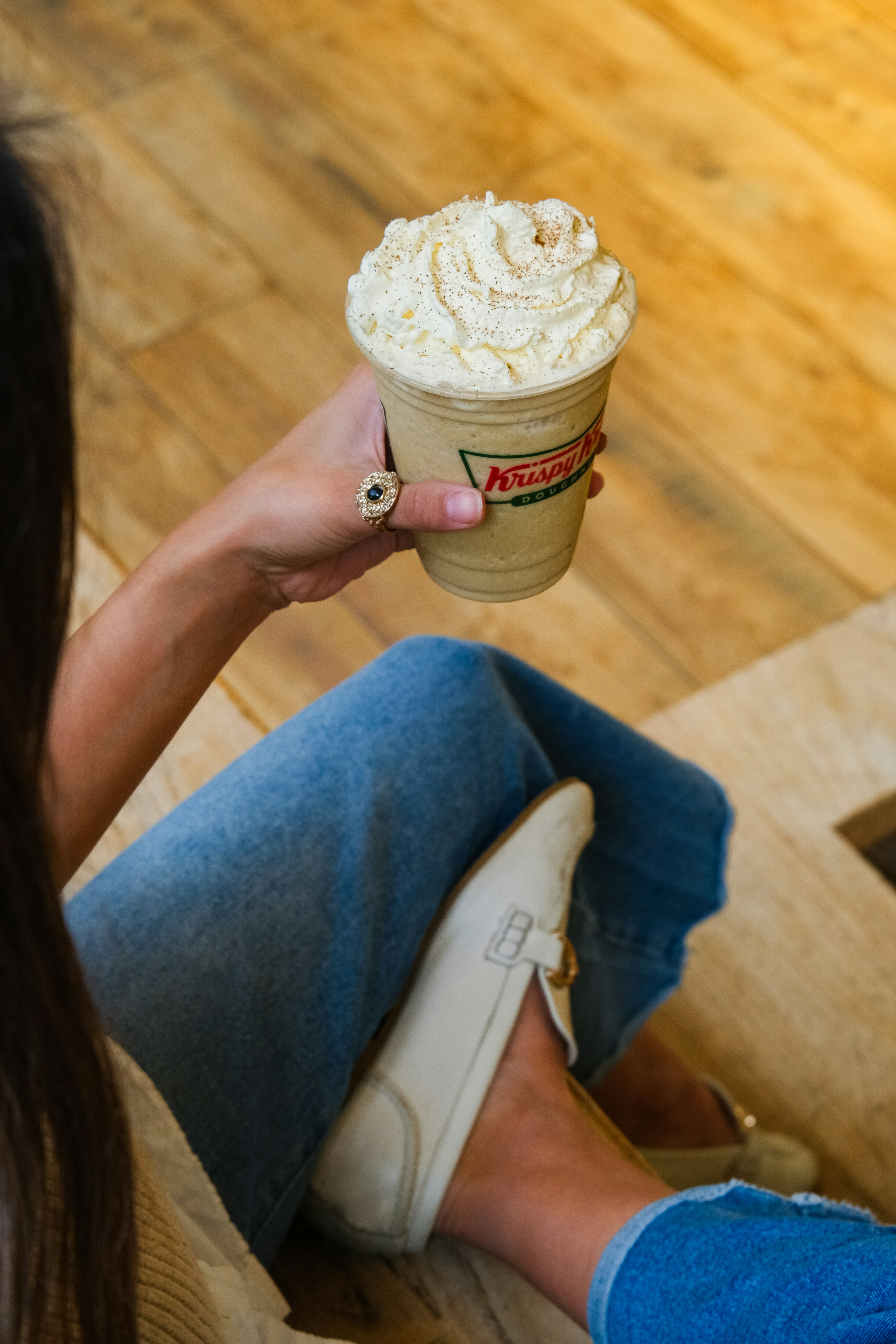 Whipped Cream at Hand: A Casual Café Moment