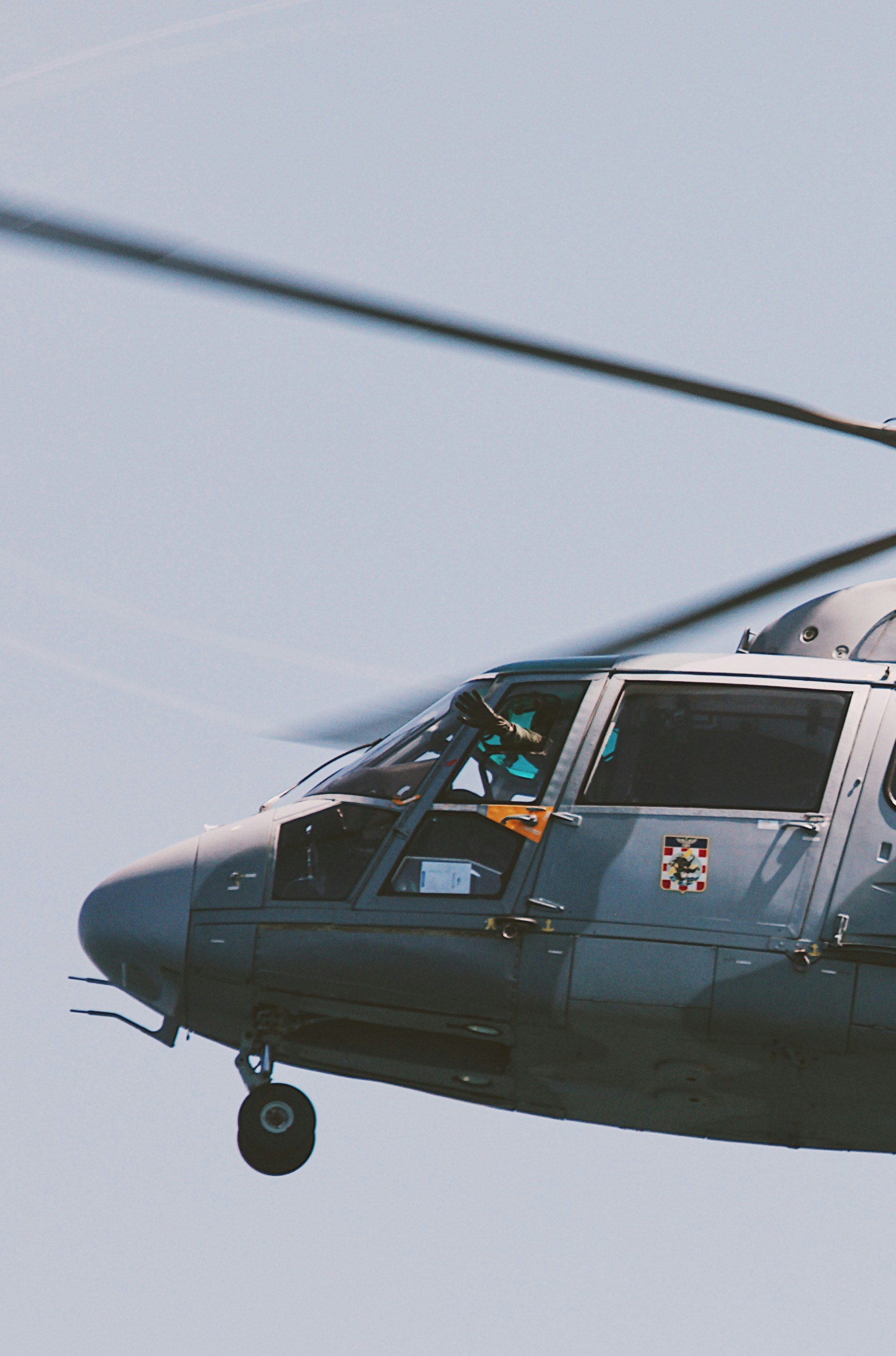 Low-Altitude Vigil: Grey Military Helicopter in Flight