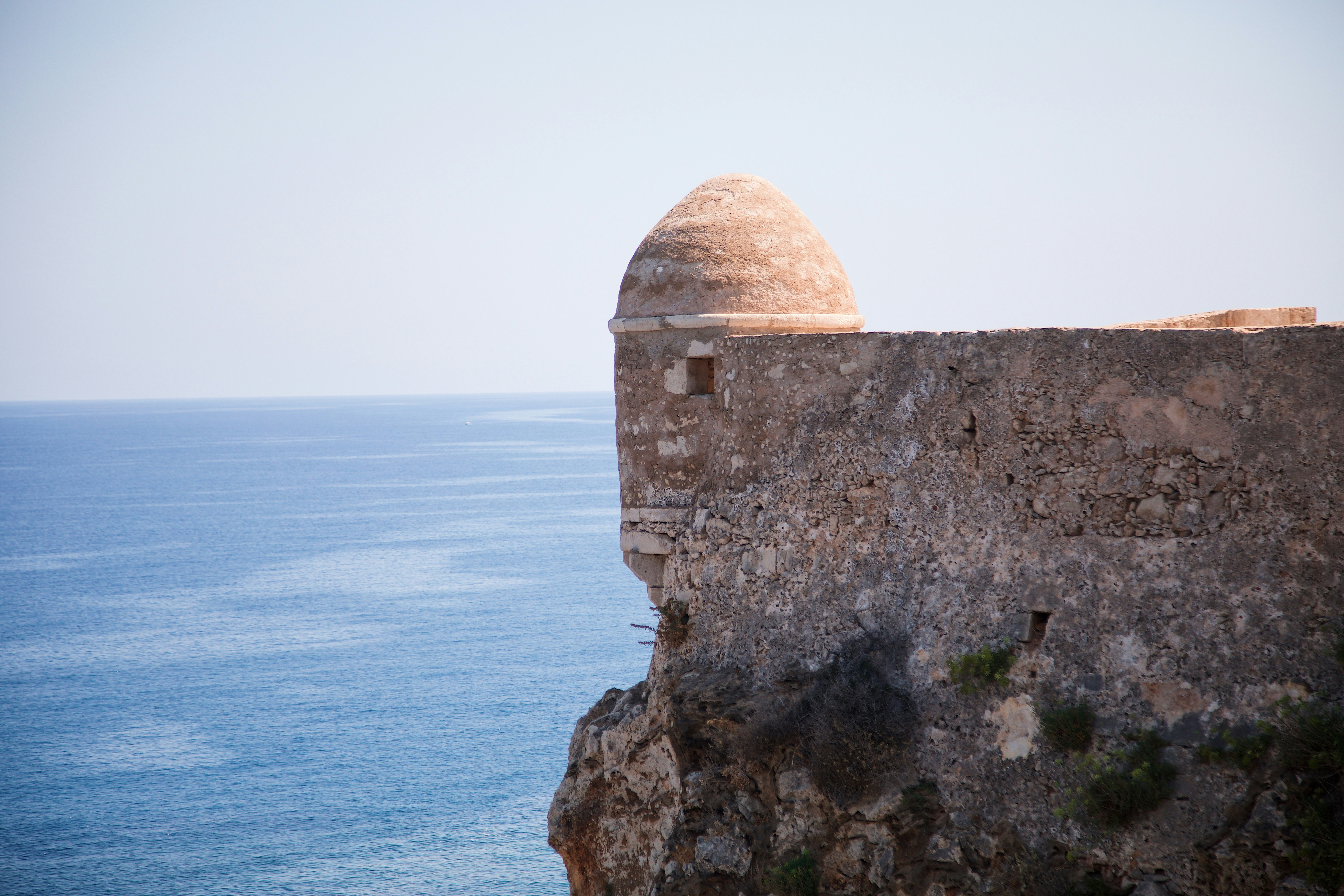 Watchtower on the precipice: a coastal fortress gazes over the blue