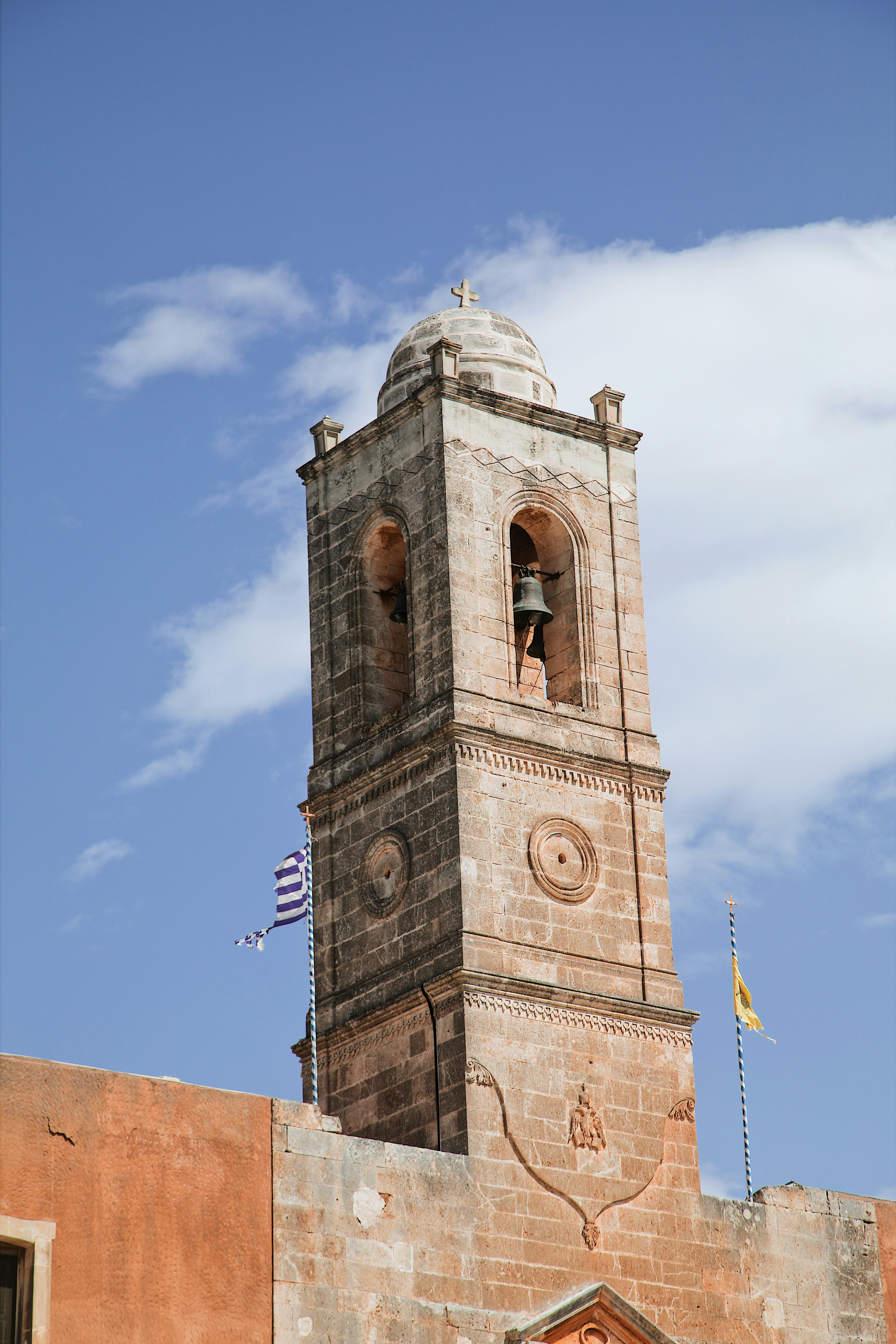 Stone Bell Tower Reaching Toward a Clear Sky