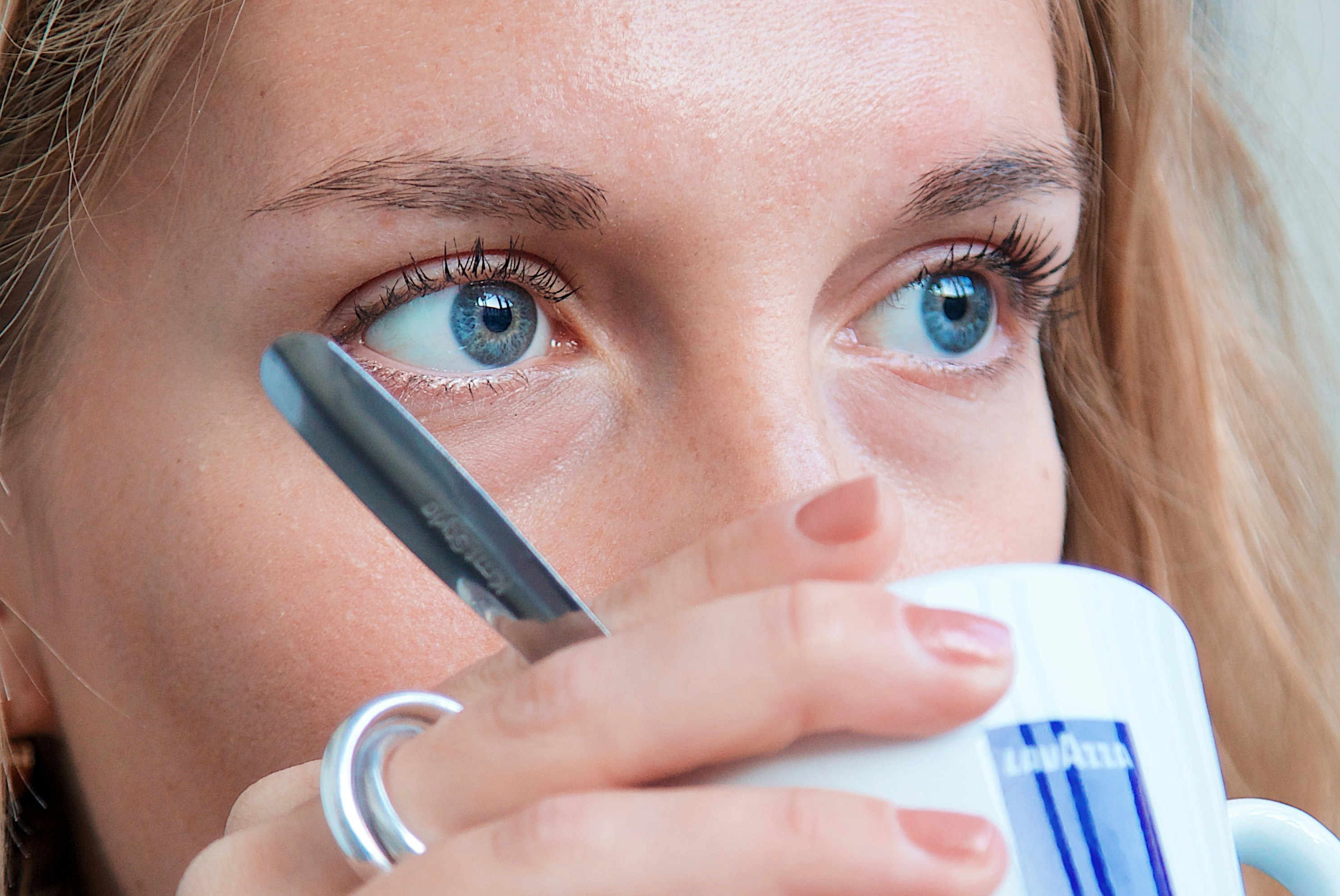 Blue Eyes and Morning Ritual: A Portrait of Focused Gaze