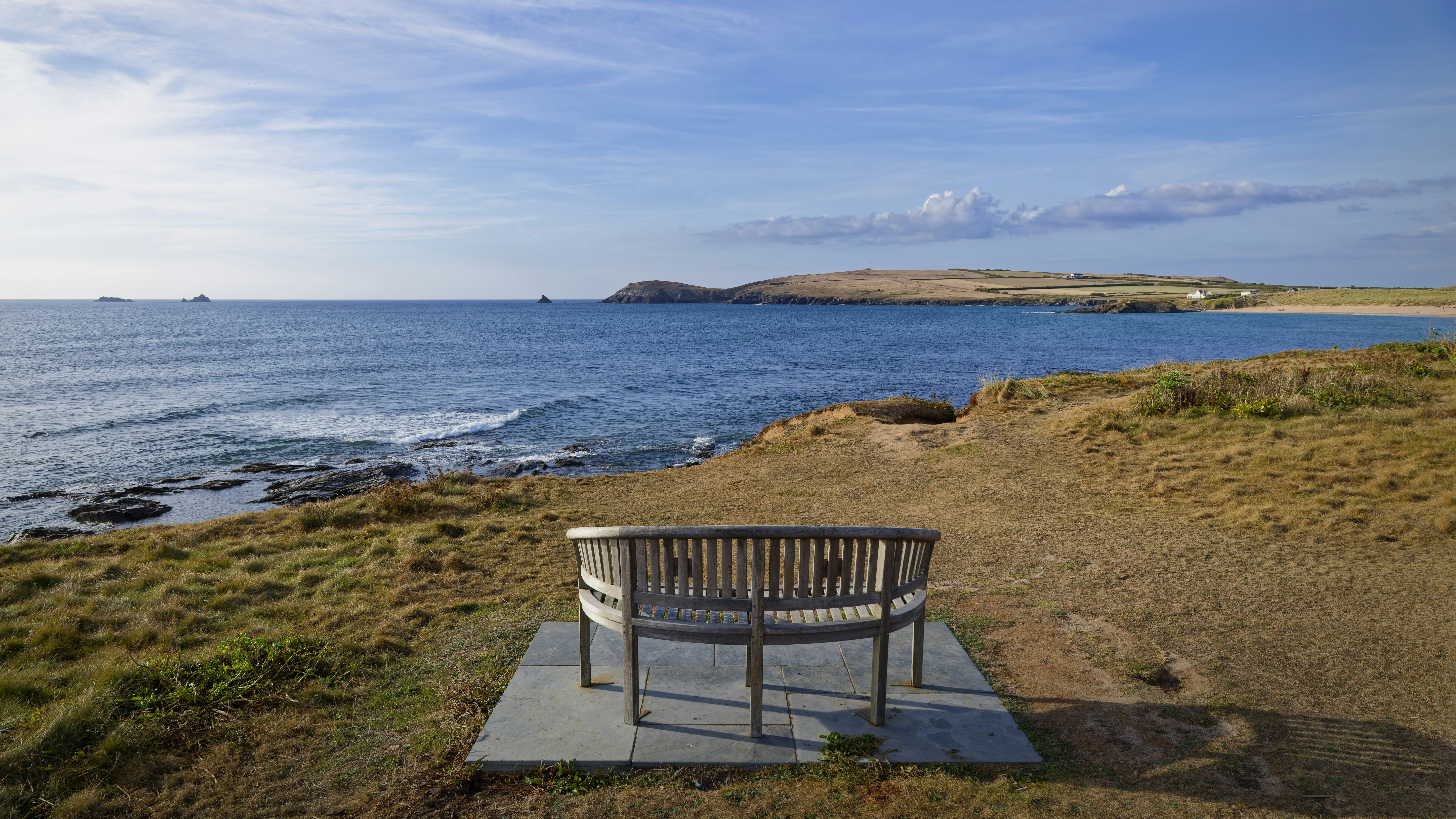 Secluded Seascape: A Quiet Bench Watches the Tidal Plains