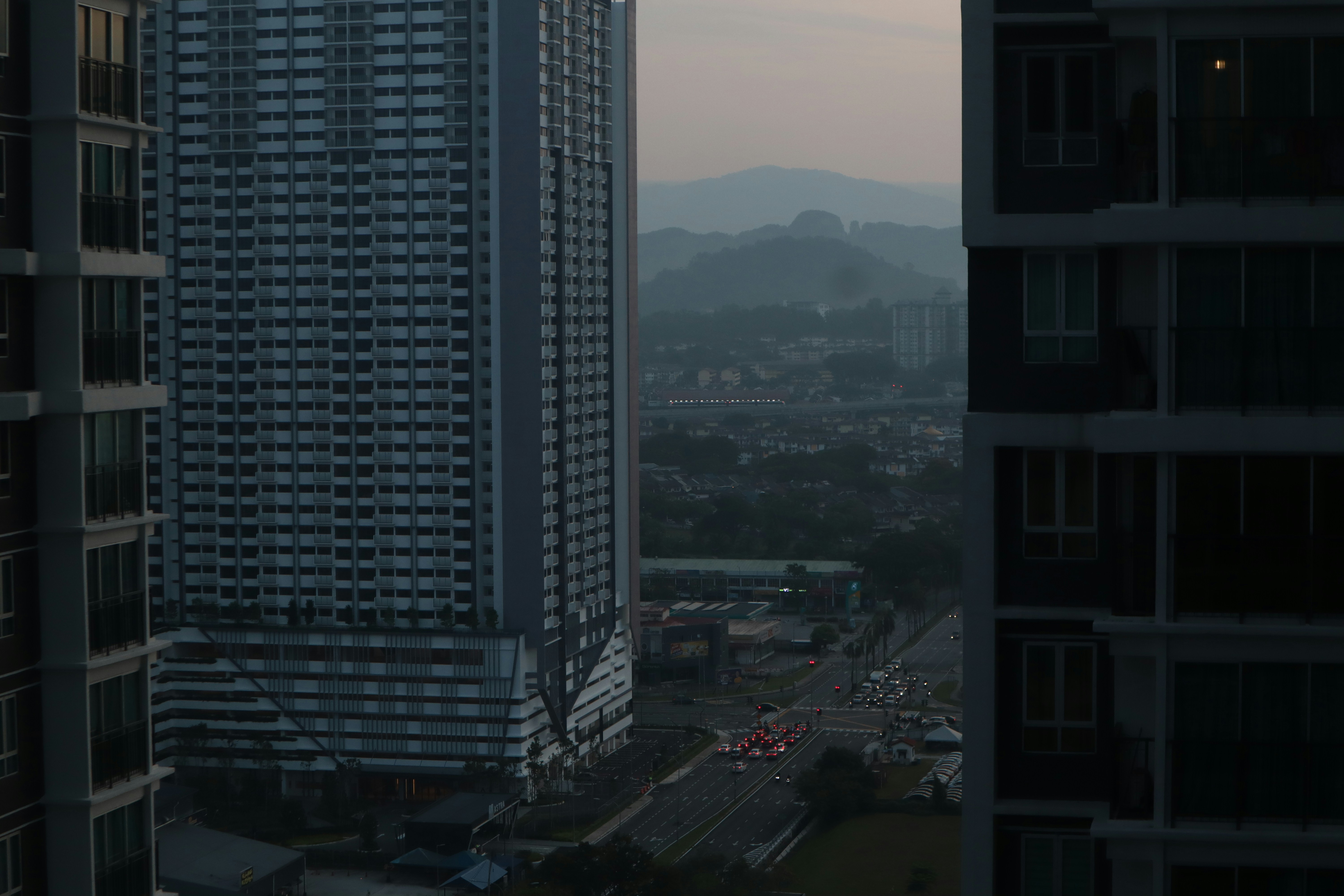 Urban canyon: street level between towering glass