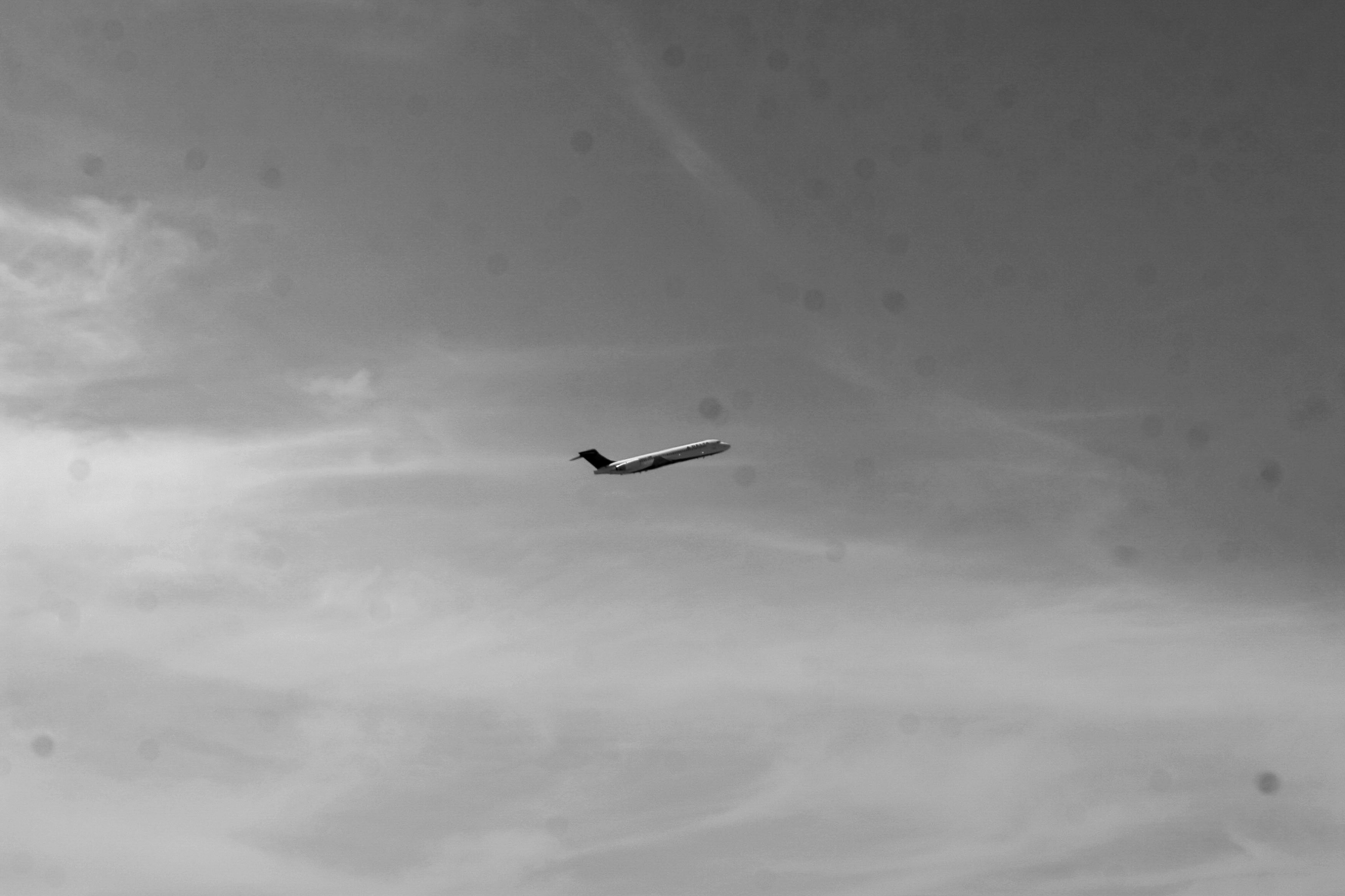 Aerial Needle: A Lone Jet Cuts Across a Quiet Sky