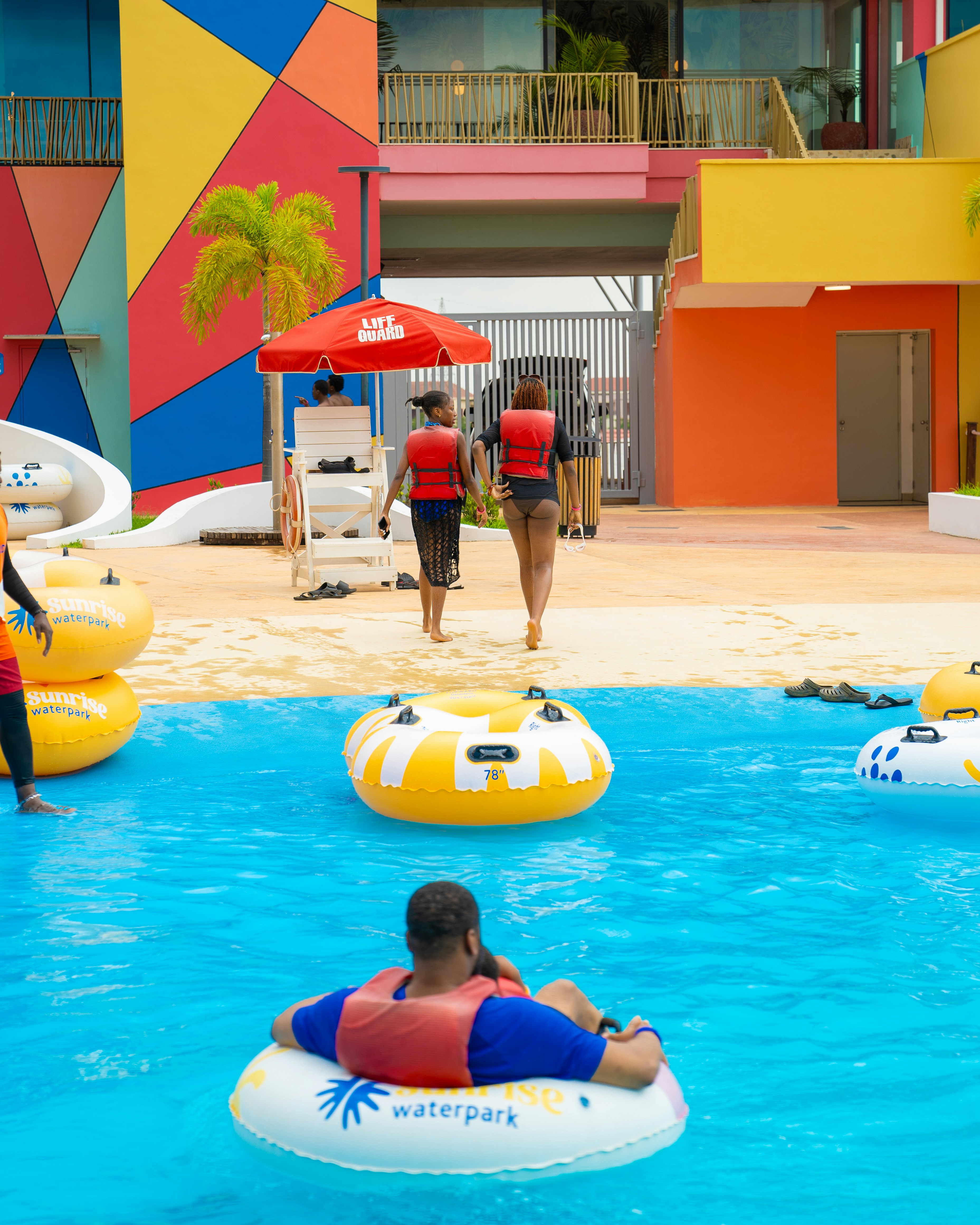 Colorful Waterpark Oasis: Tweed of Red Swimwear by the Splash Zone