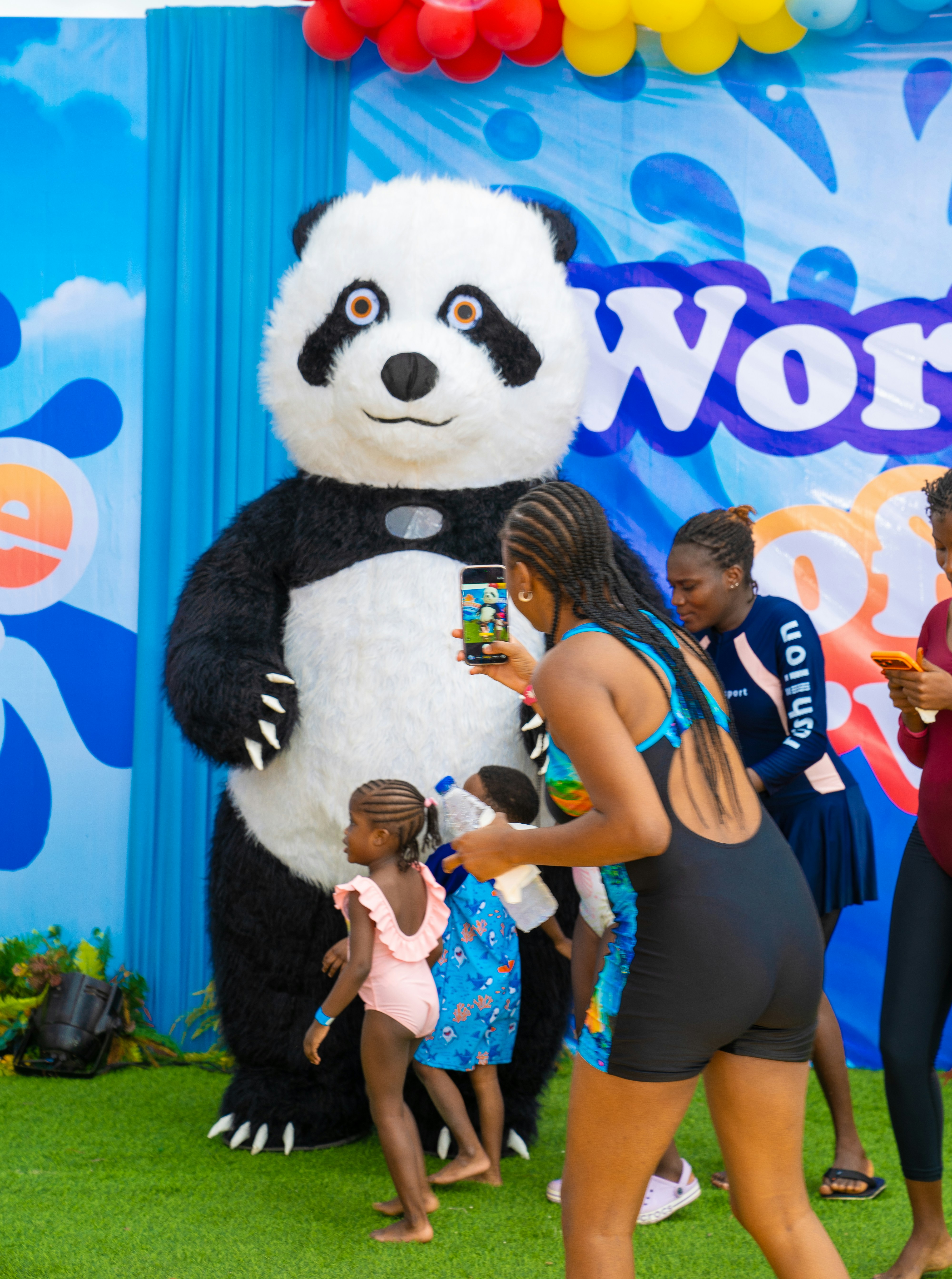 Panda Meet-and-Greet: Guests Capture a Moment with a Giant Mascot