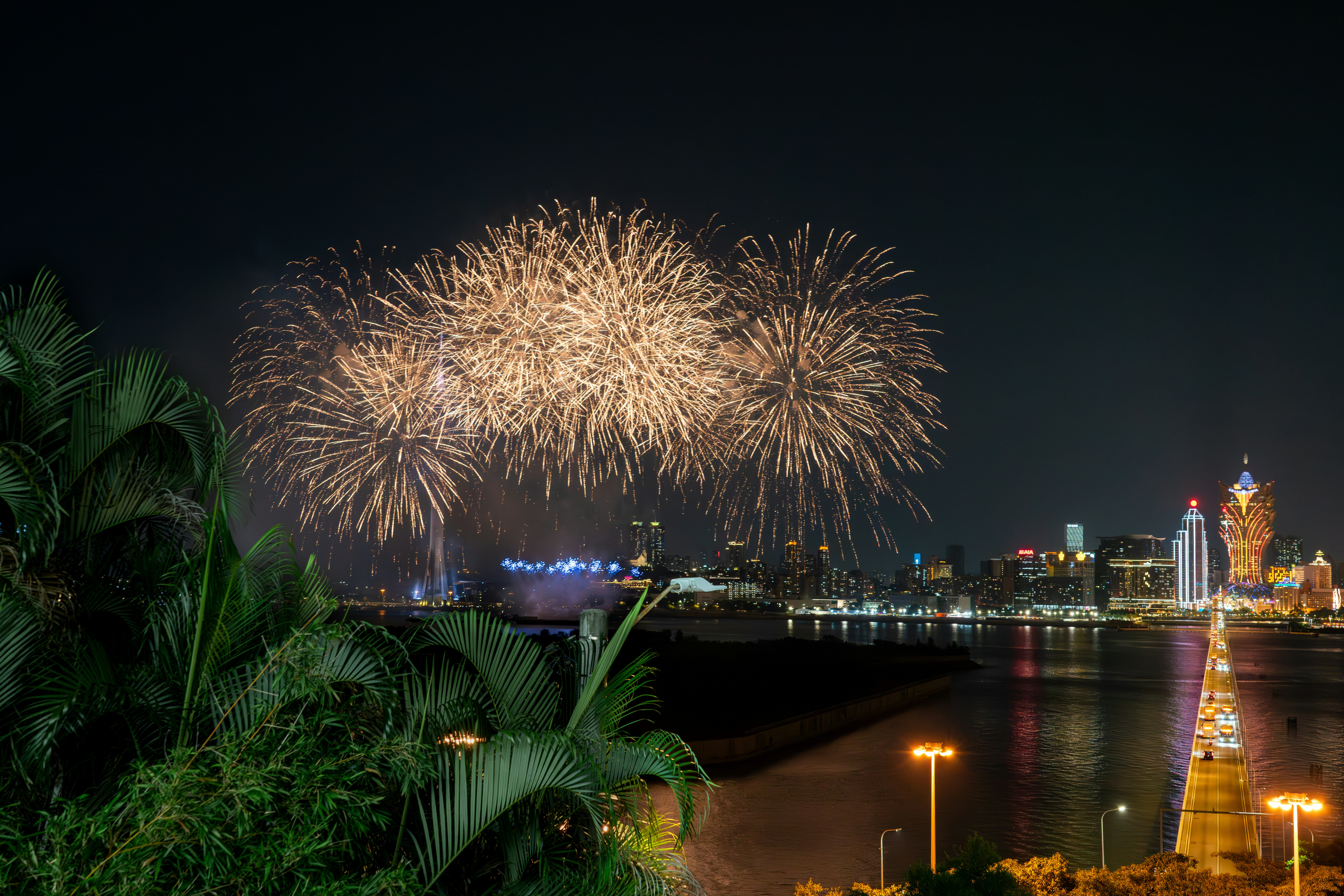 Fireworks over a neon-lit harbor: nightscape fragmentation