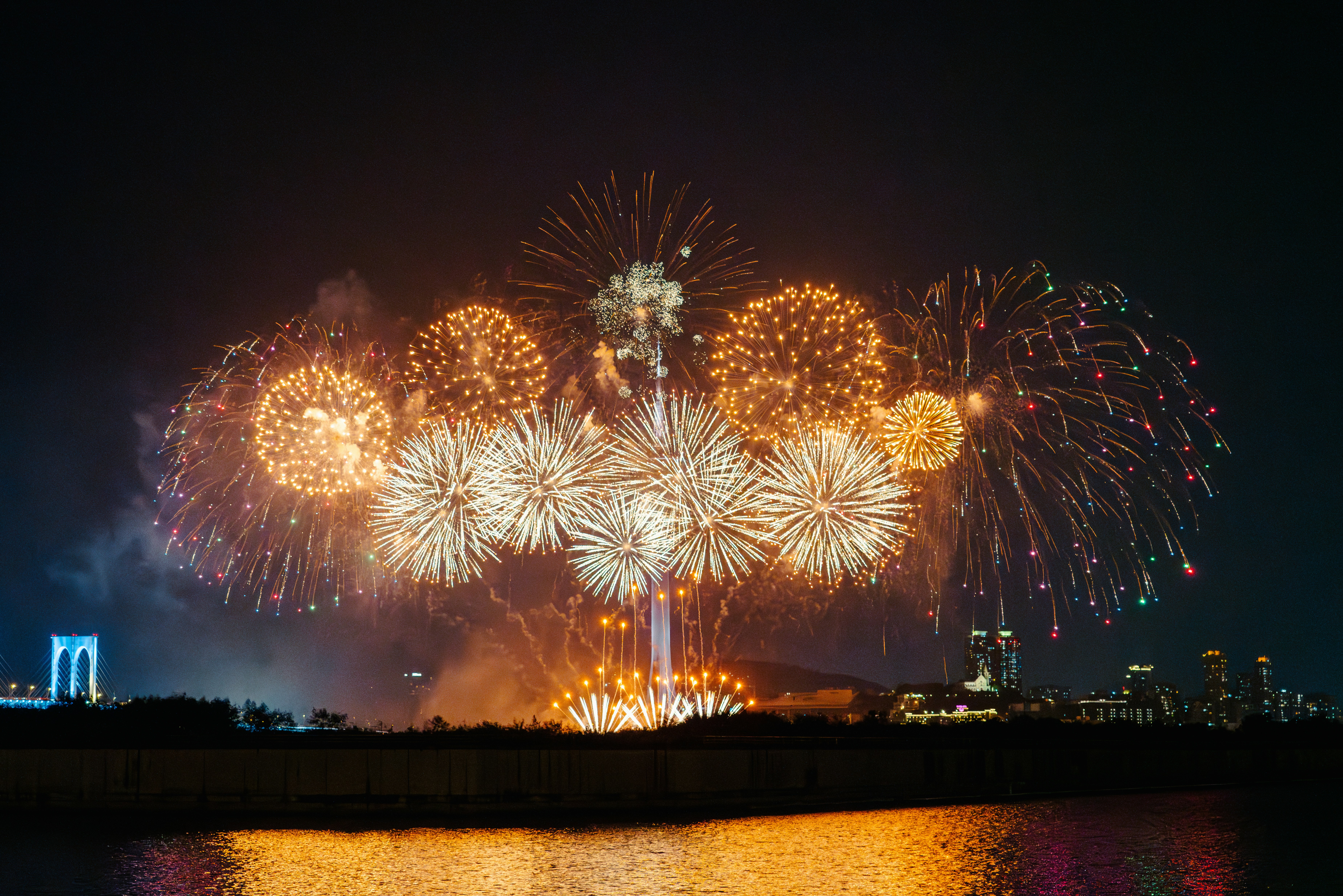 Night Bloom: Fireworks Over the Riverside Skyline