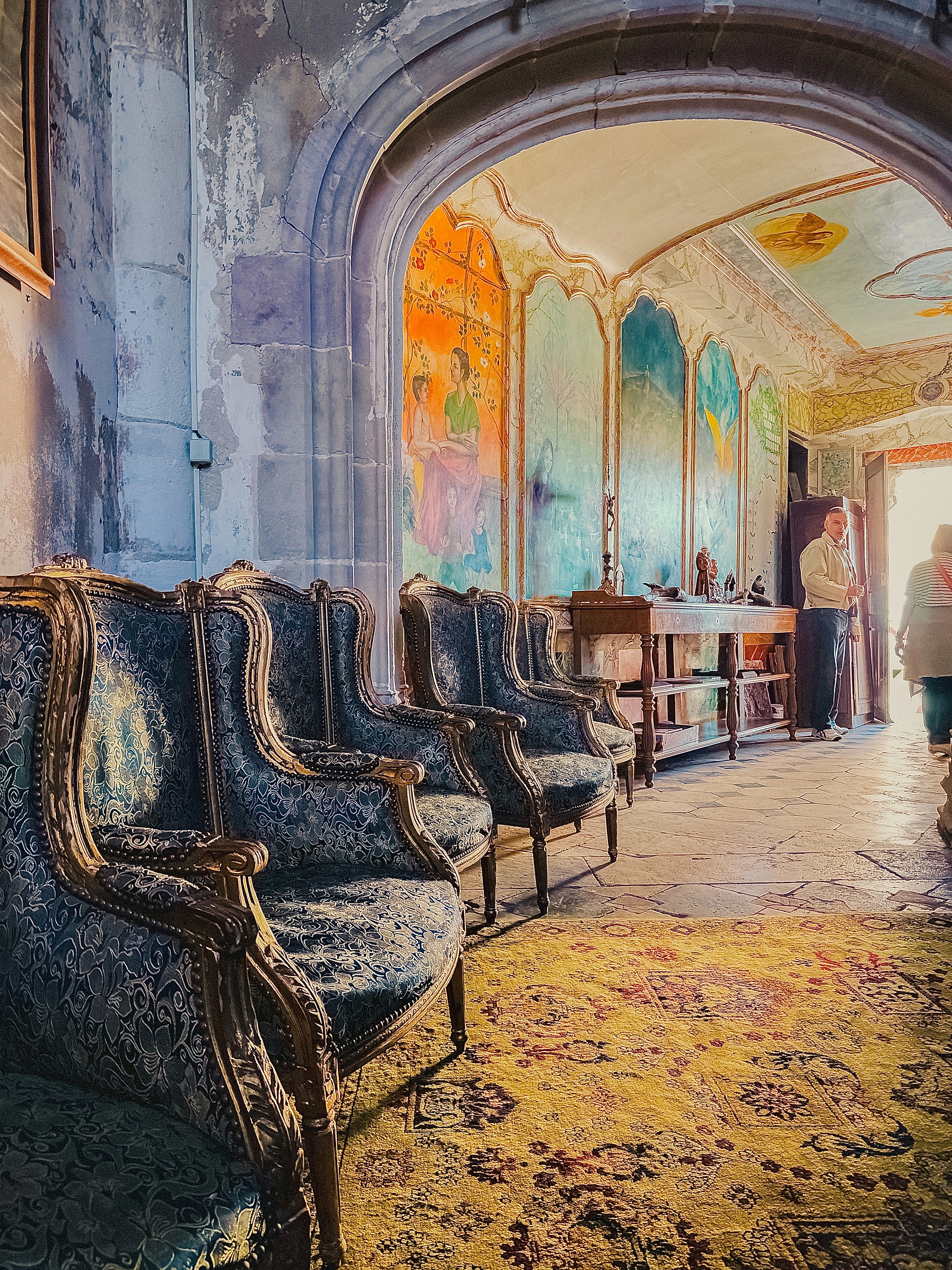 Echoes of Velvet and Light in a Painted Hallway