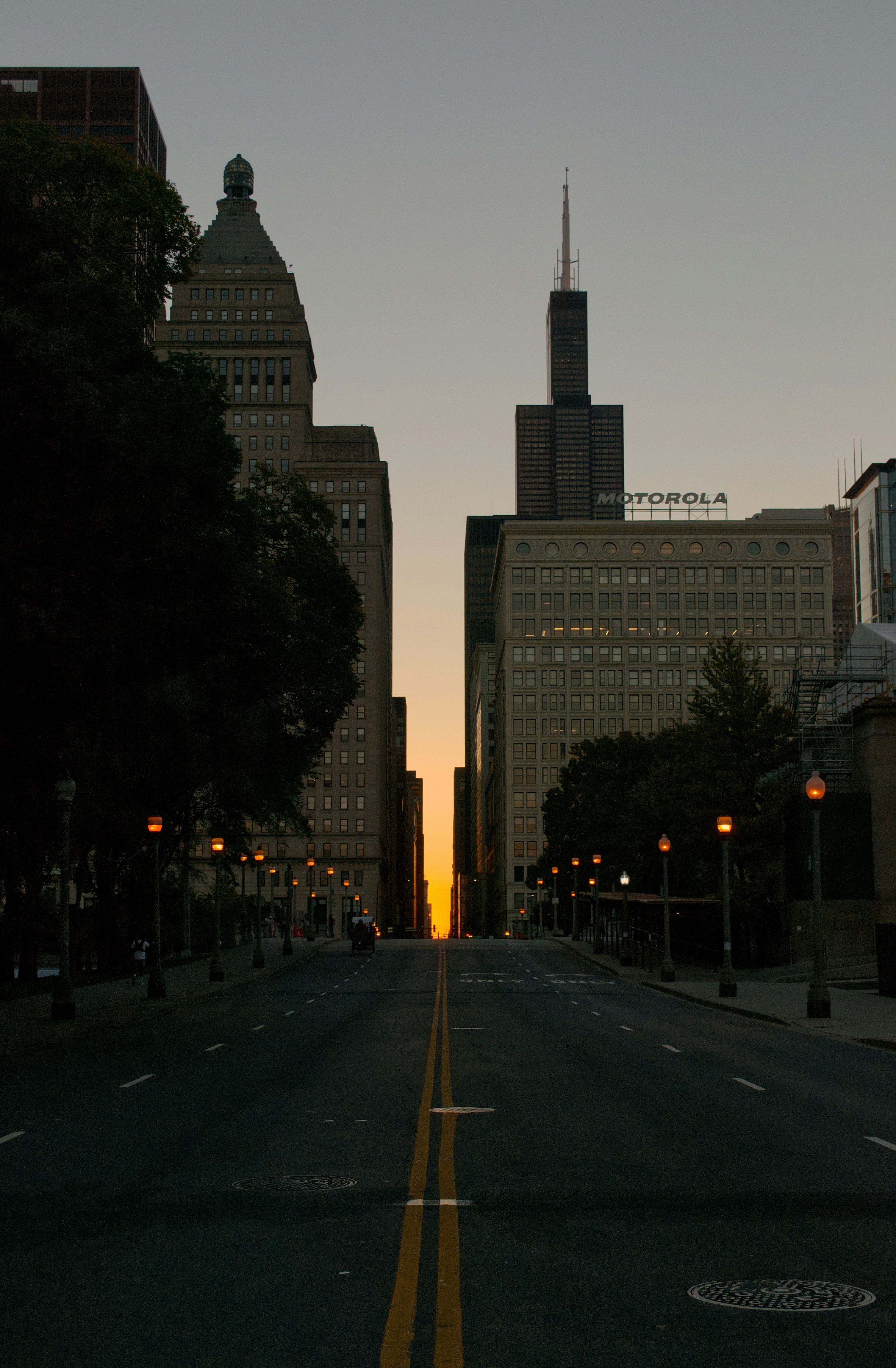 Sunset Resolve: A Quiet Downtown Corridor Framed by Tall Shadows